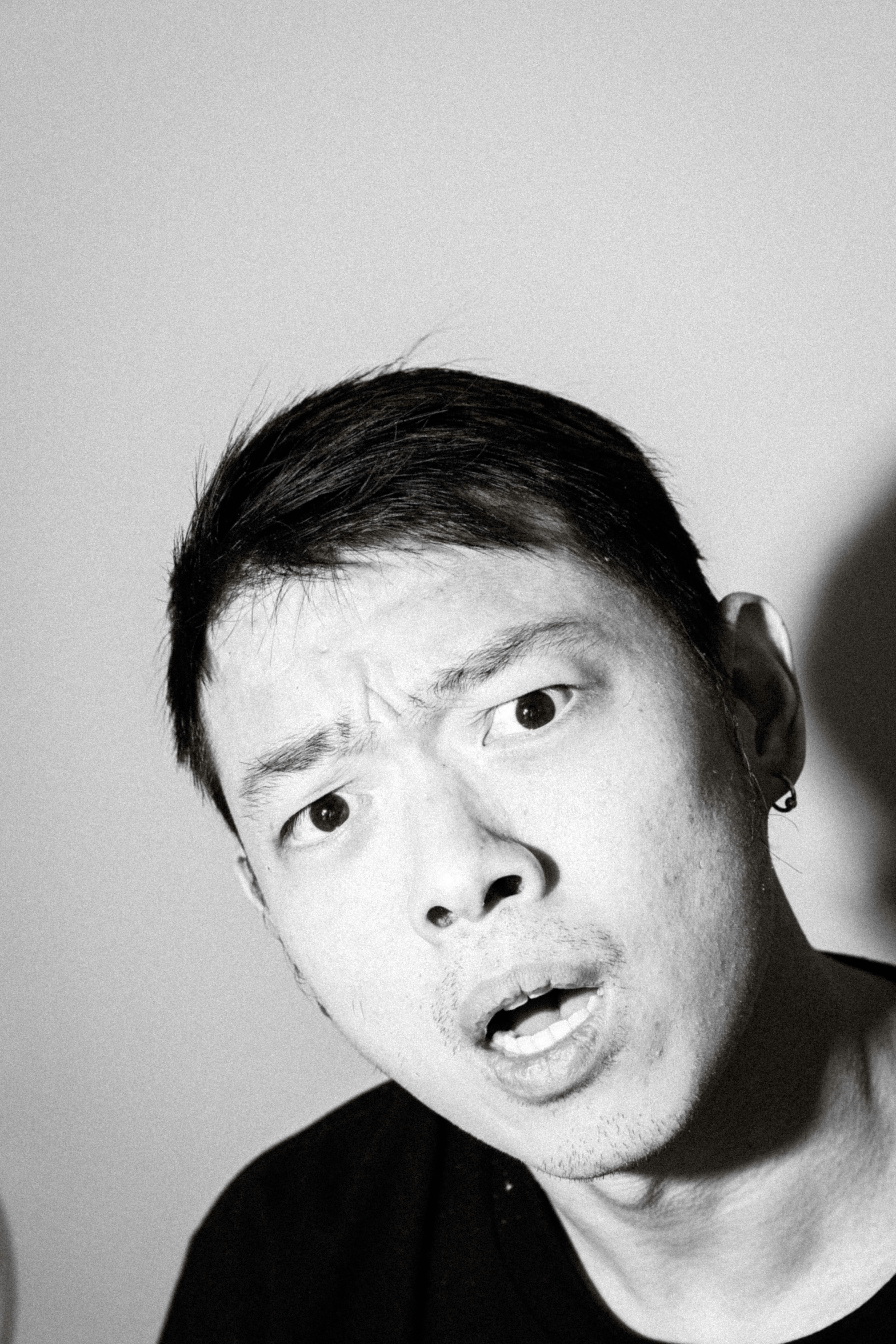 A black and white photo of a man making a face photo – Free Portrait ...