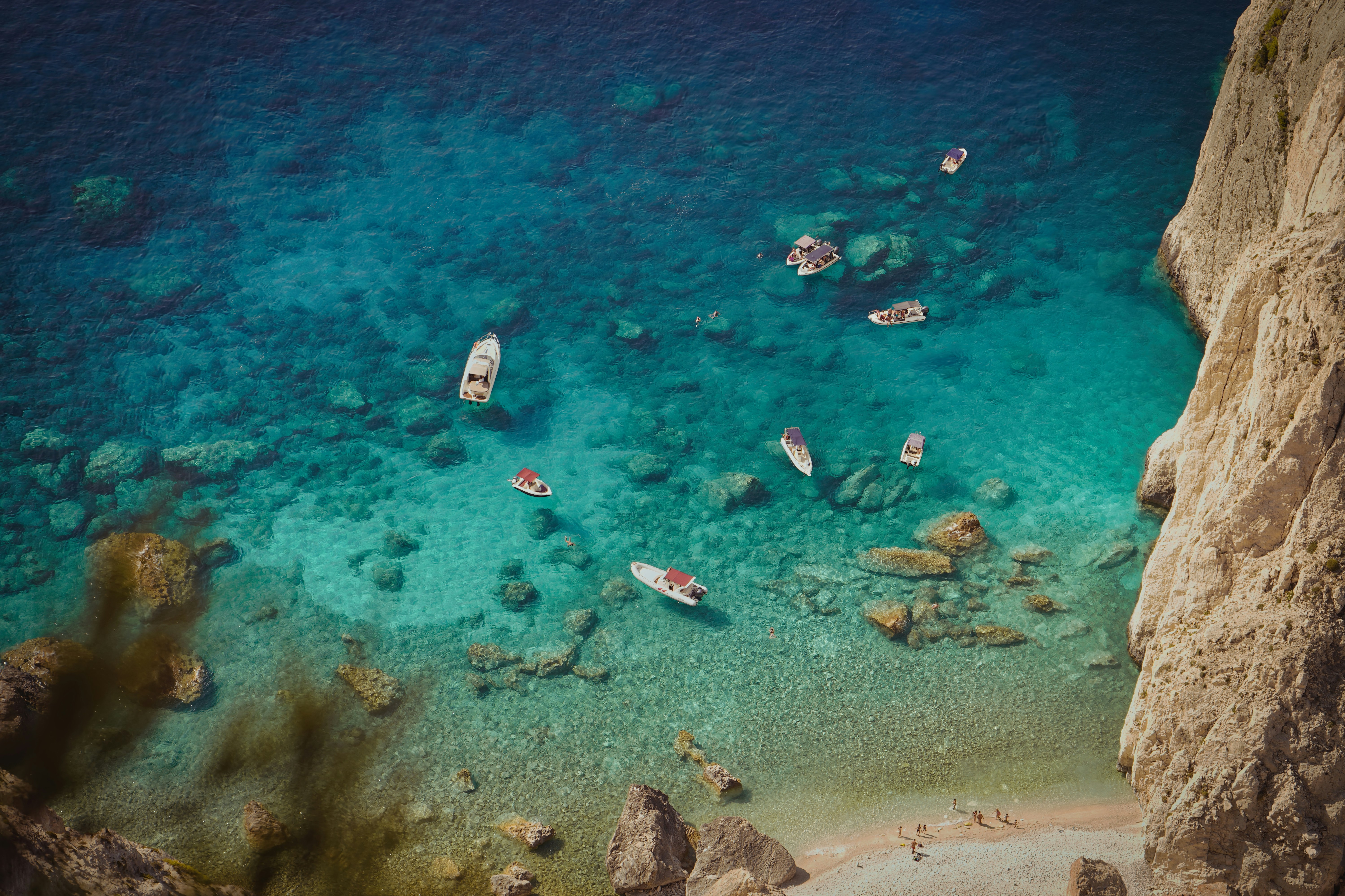 Azure Ledge: A Fleet Hovering Above Crystal Turquoise Cove