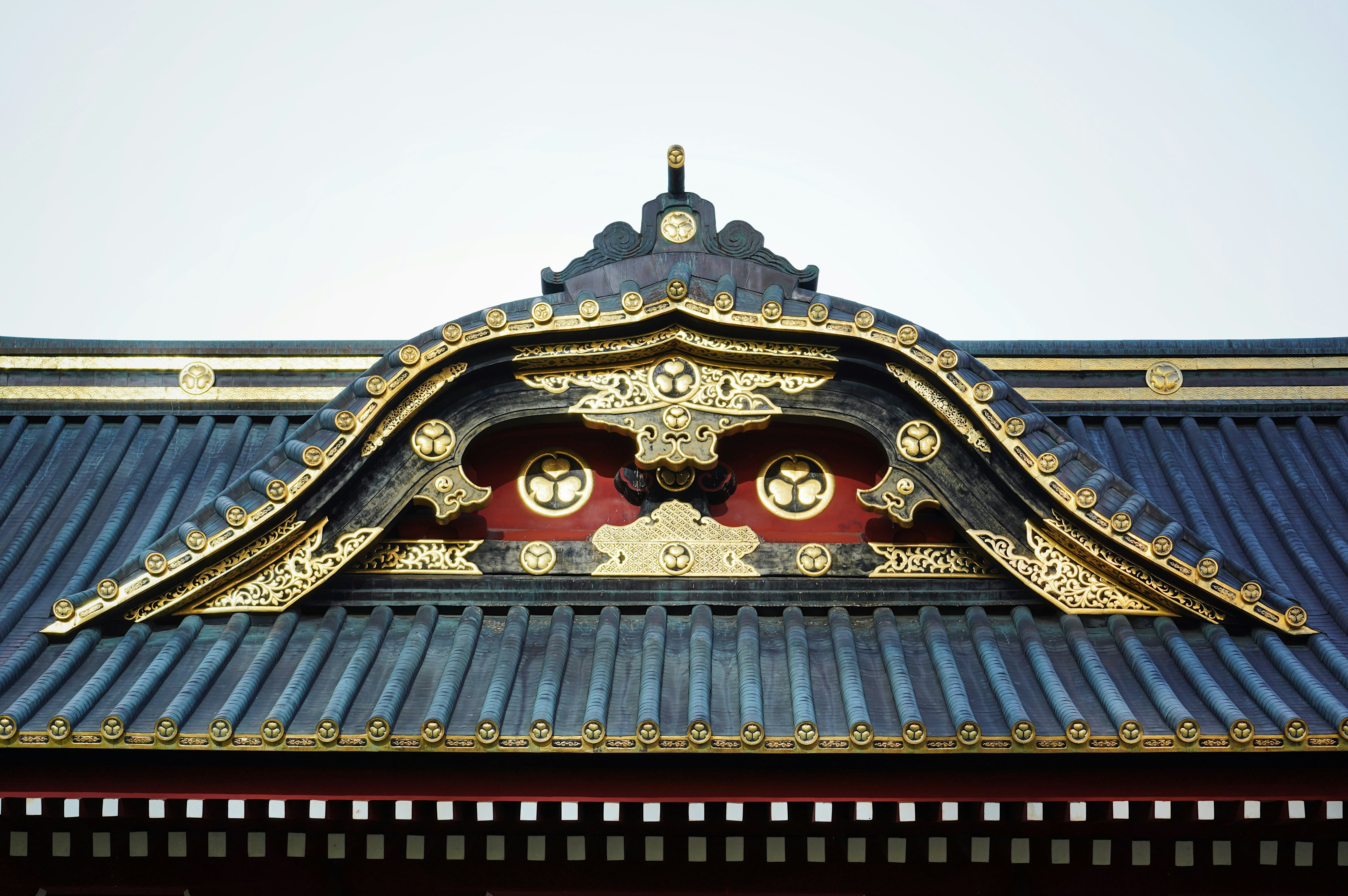 Gold Crest Ridge: Intricate Ornamentation on a Japanese Temple Roof