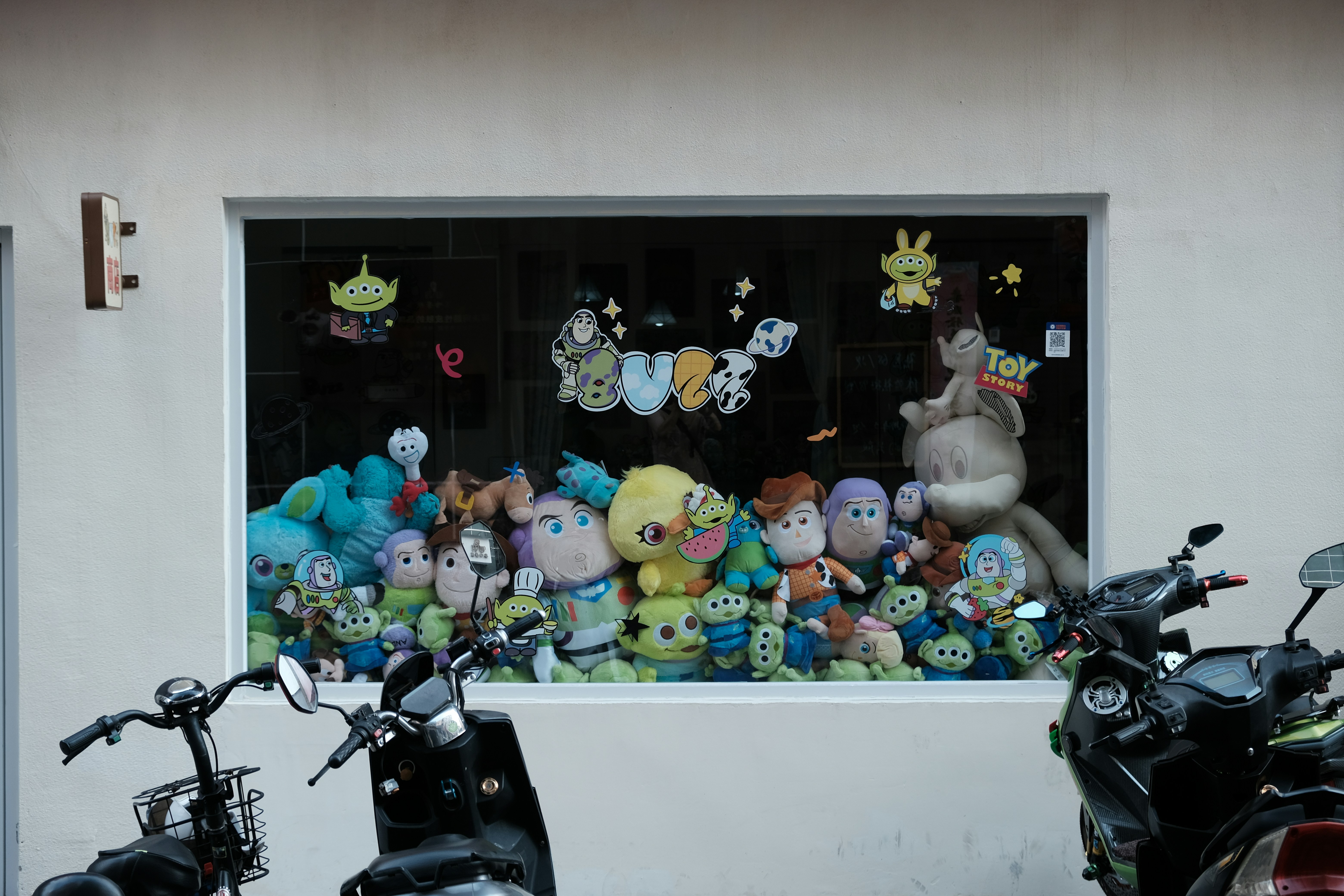 Colorful Plush Parade in a Toy Store Window