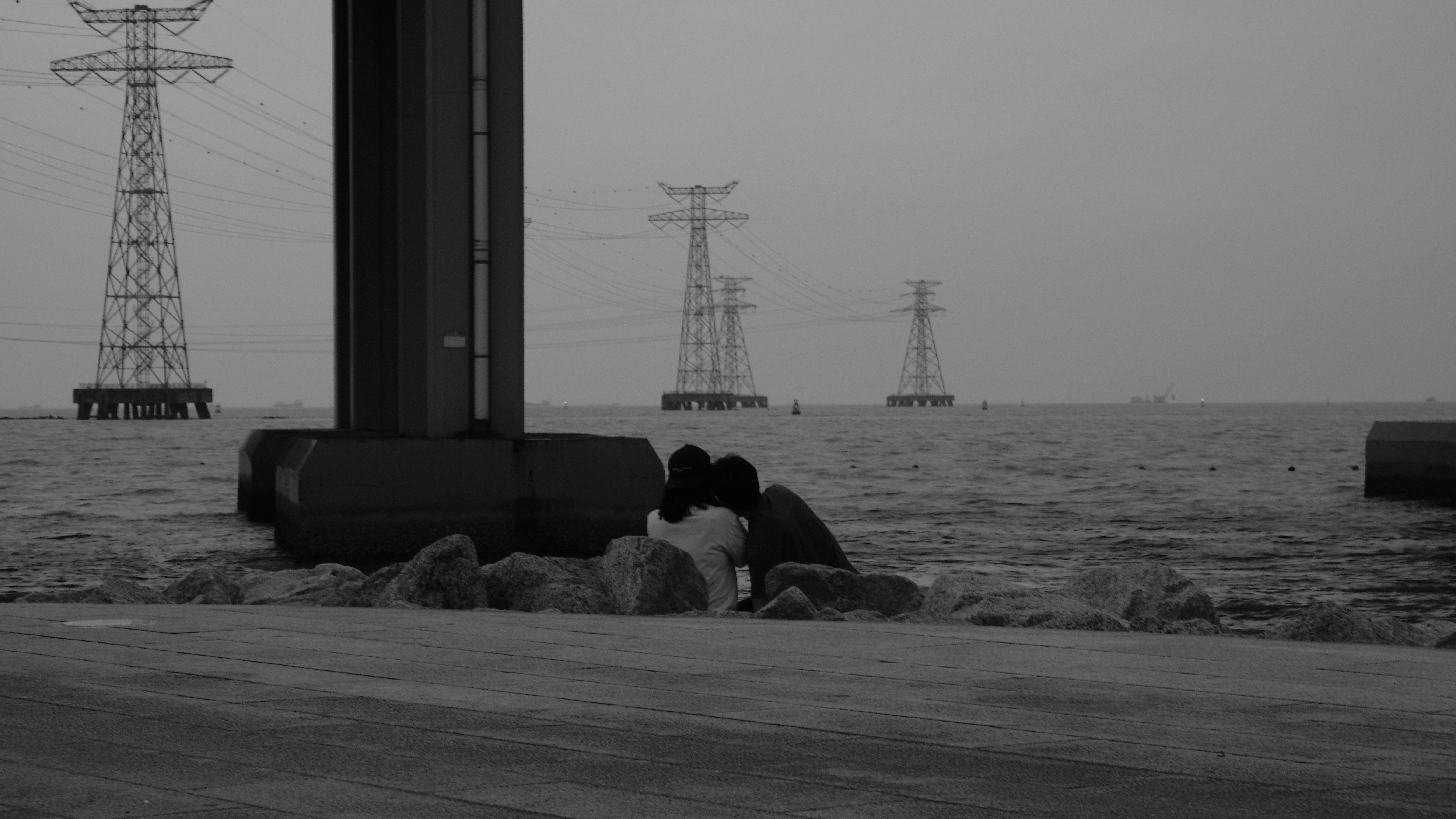 Rough Couple by the Quiet Pier