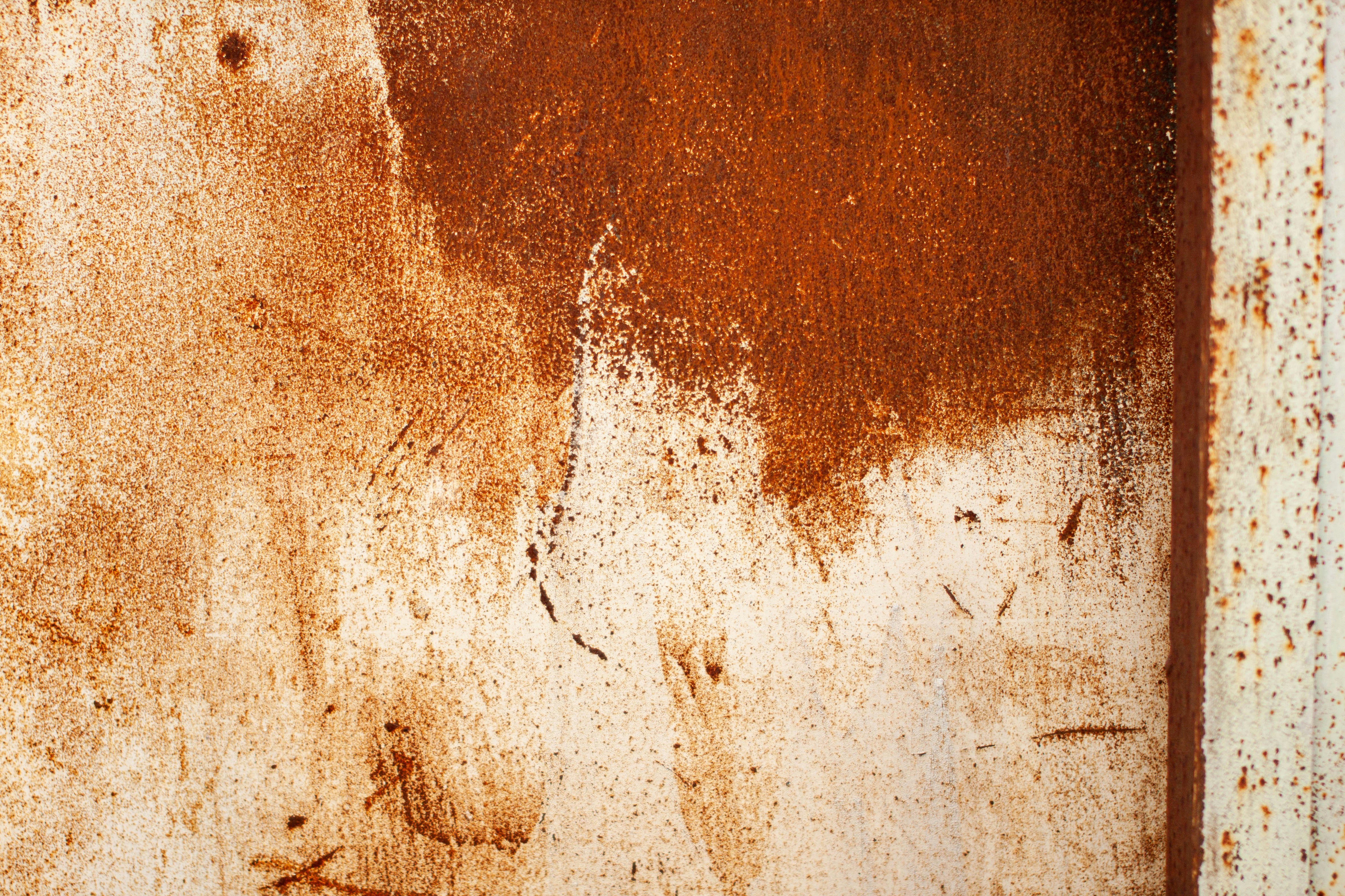 A rusted metal surface with a rusted wall photo – Free Brown Image on ...