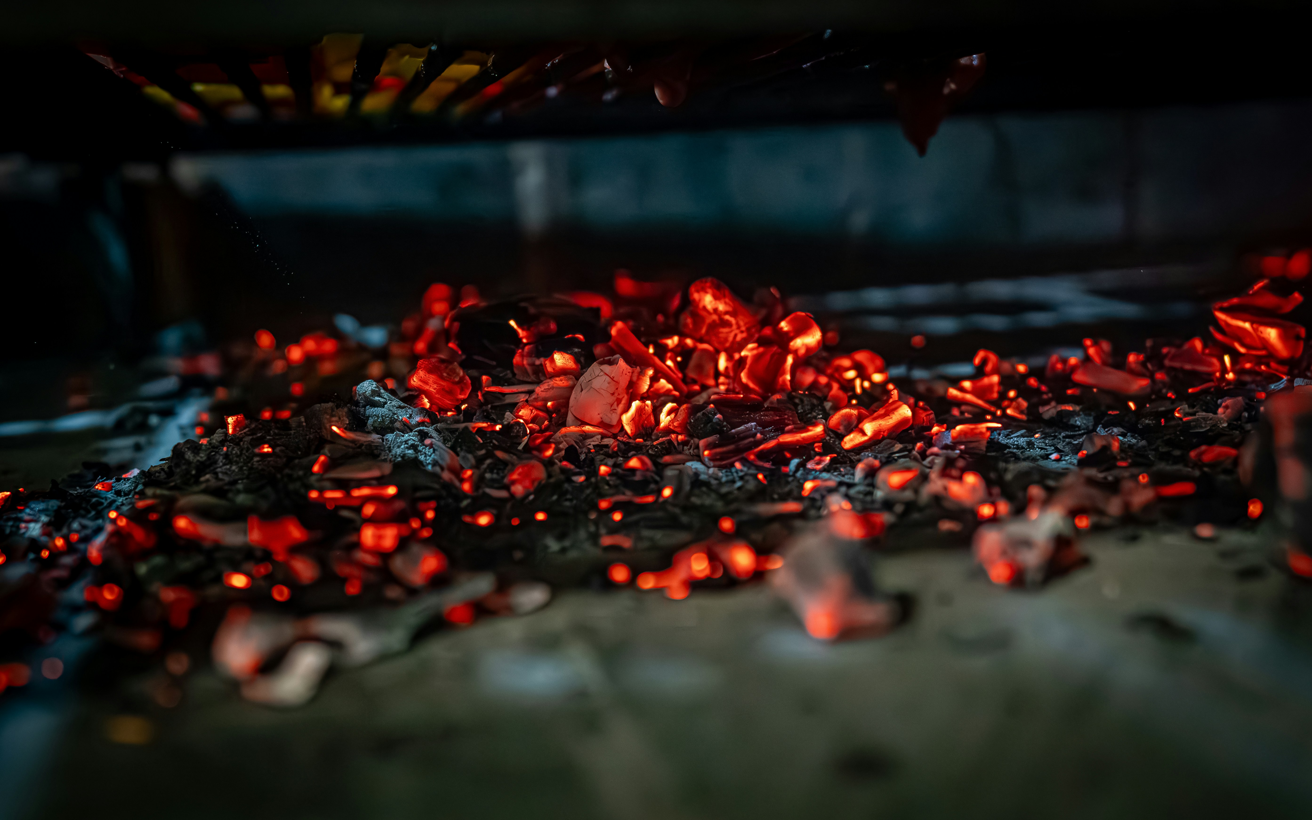 A pile of red hot coals sitting on top of a table photo – Free Uruguay ...