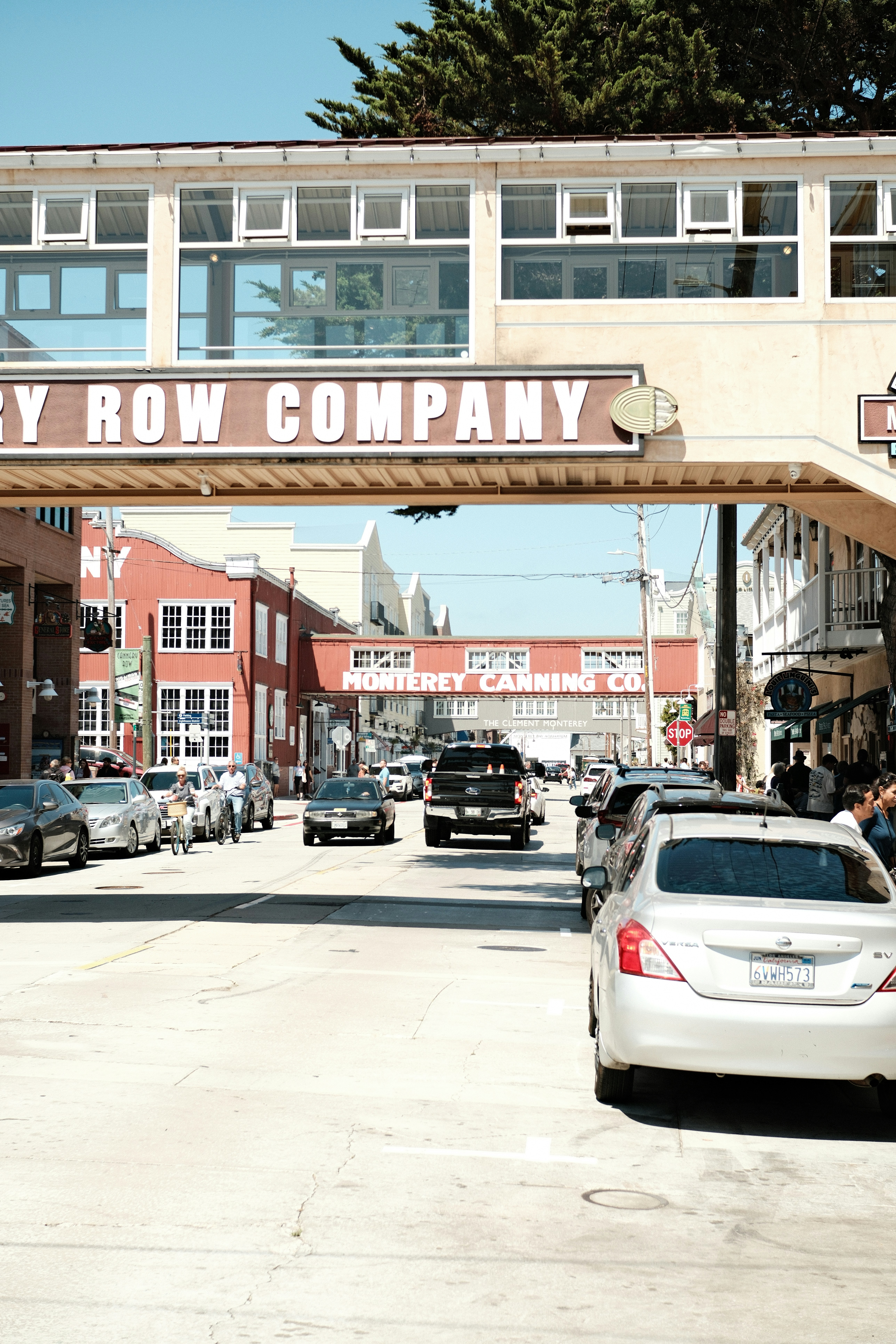 Monterey Canning Co. Signscape: A Sunlit Street Corridor