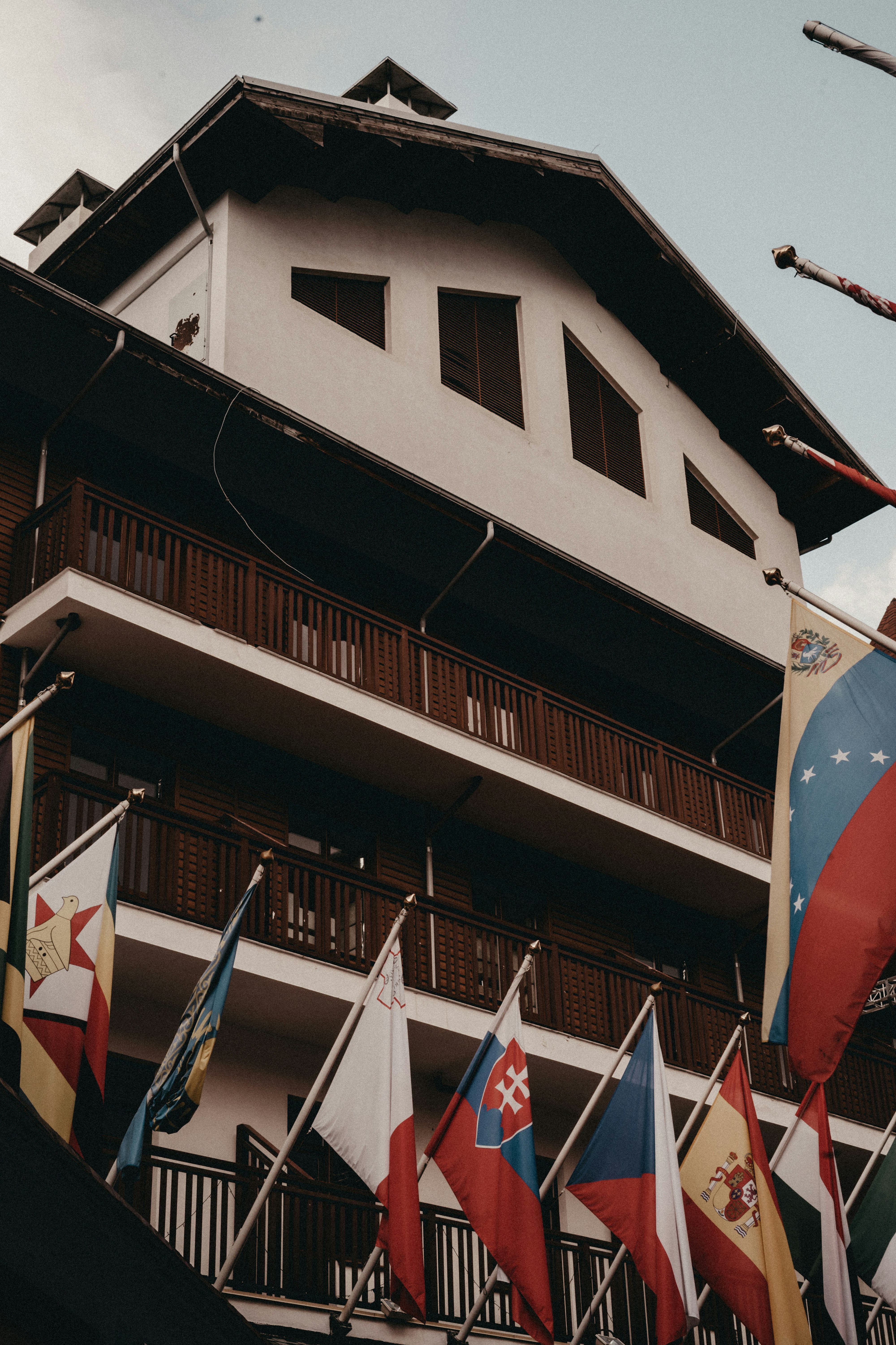 Flag-Festooned Lodge Tilting Toward the Sky