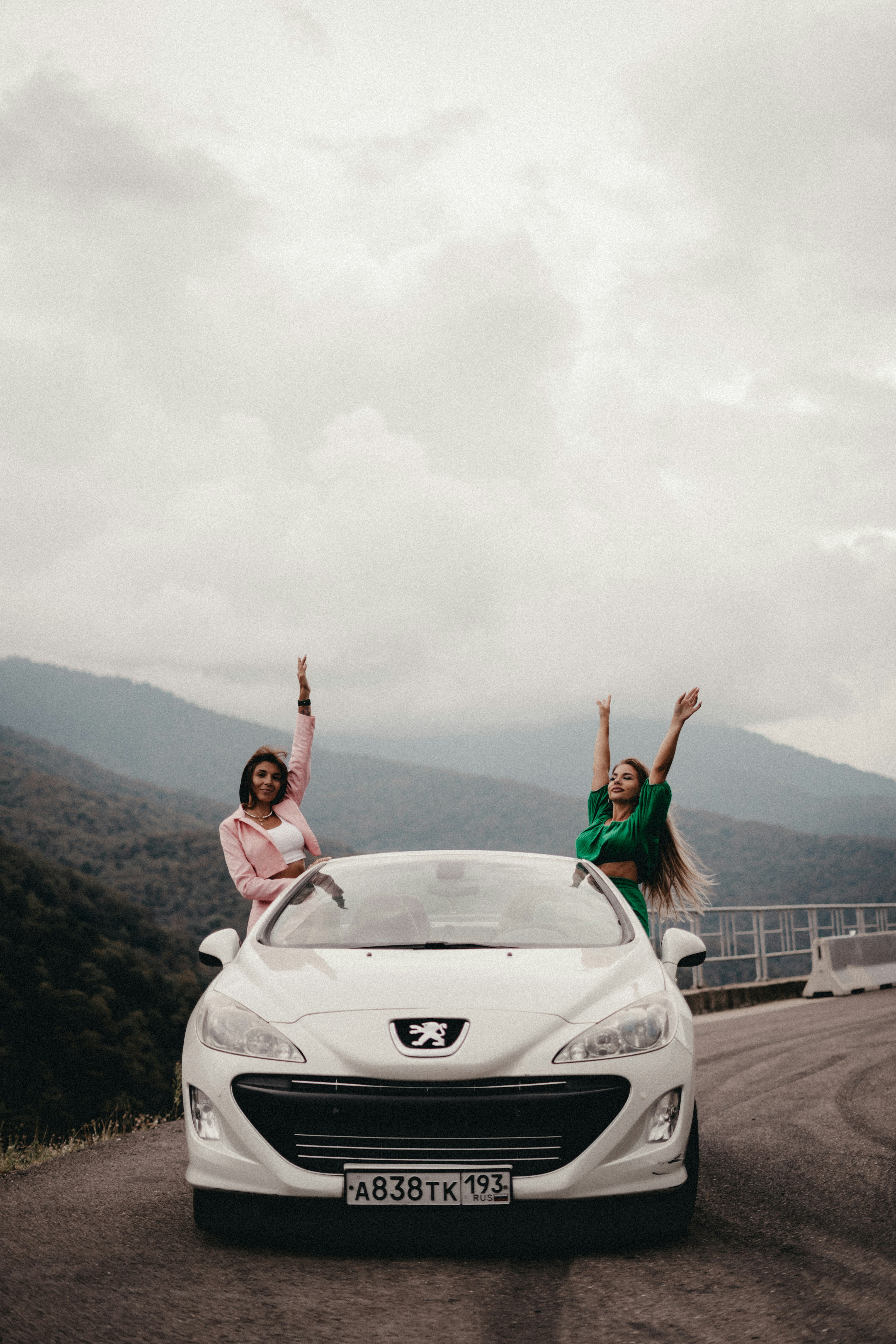 Summit Curve Serenade: Cheers from an Open-Top on a Mountain Pass