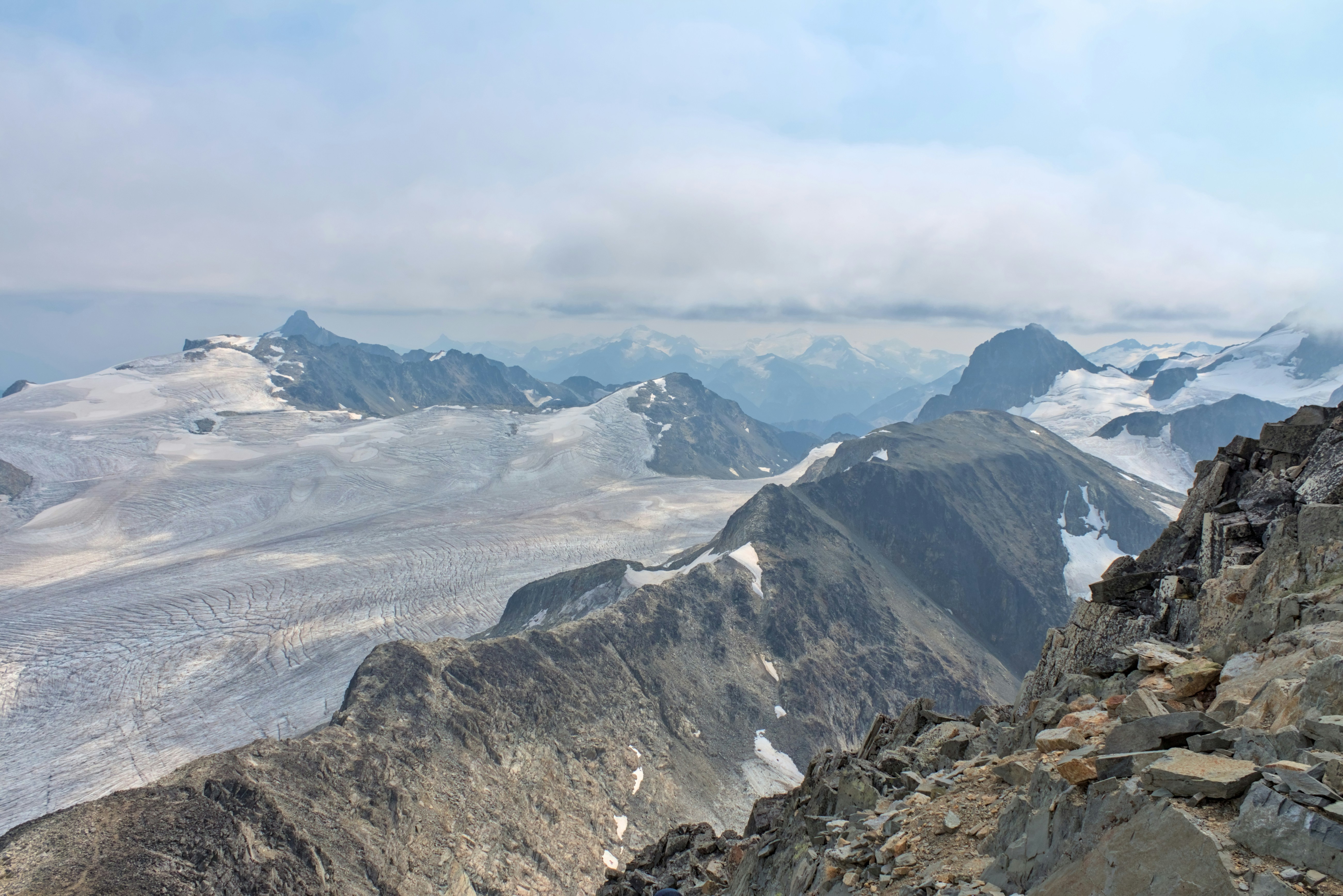 A view of a mountain range with a glacier in the distance photo – Free ...