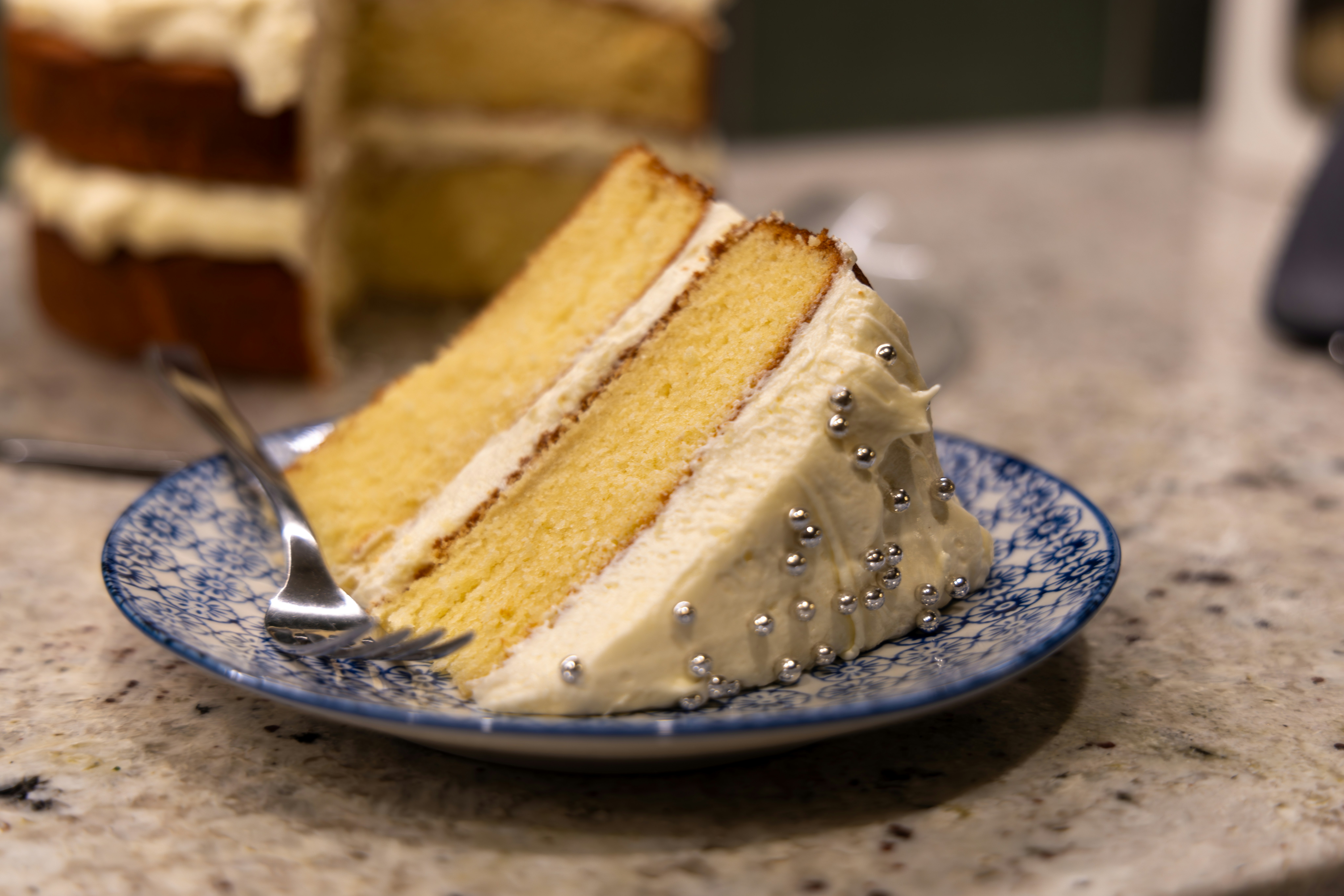 Sweet Segments: A Vanilla Layer Cake on a Blue Plate