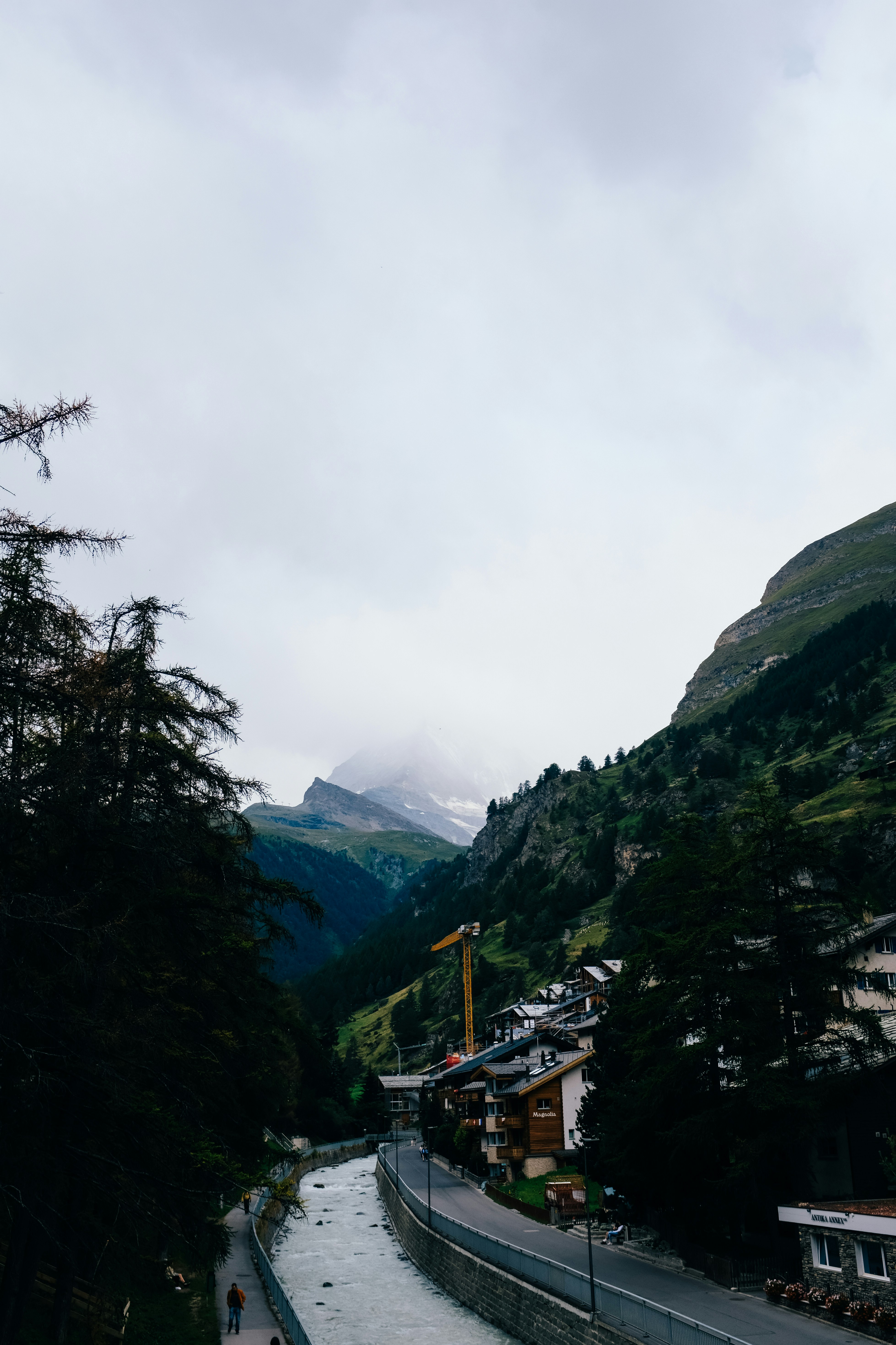A river running through a lush green hillside photo – Free Road Image ...
