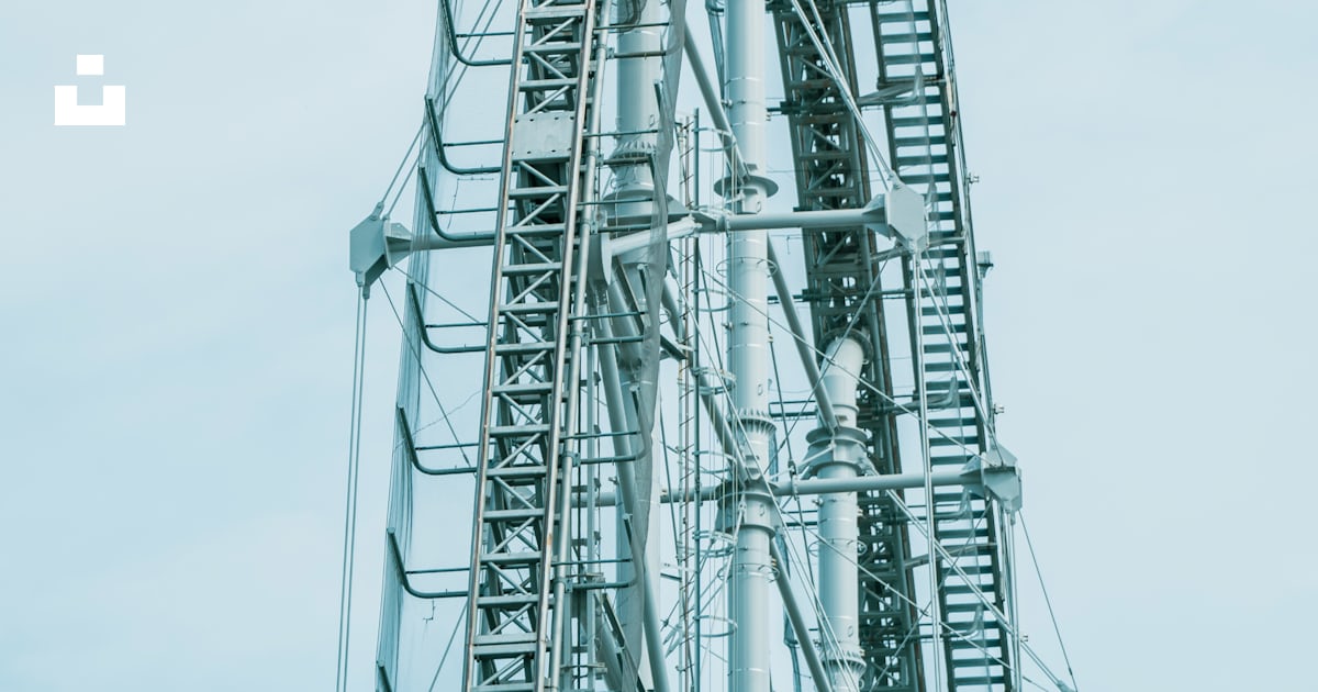 A Roller Coaster Going Down A Hill On A Cloudy Day Photo Free Fun Image On Unsplash