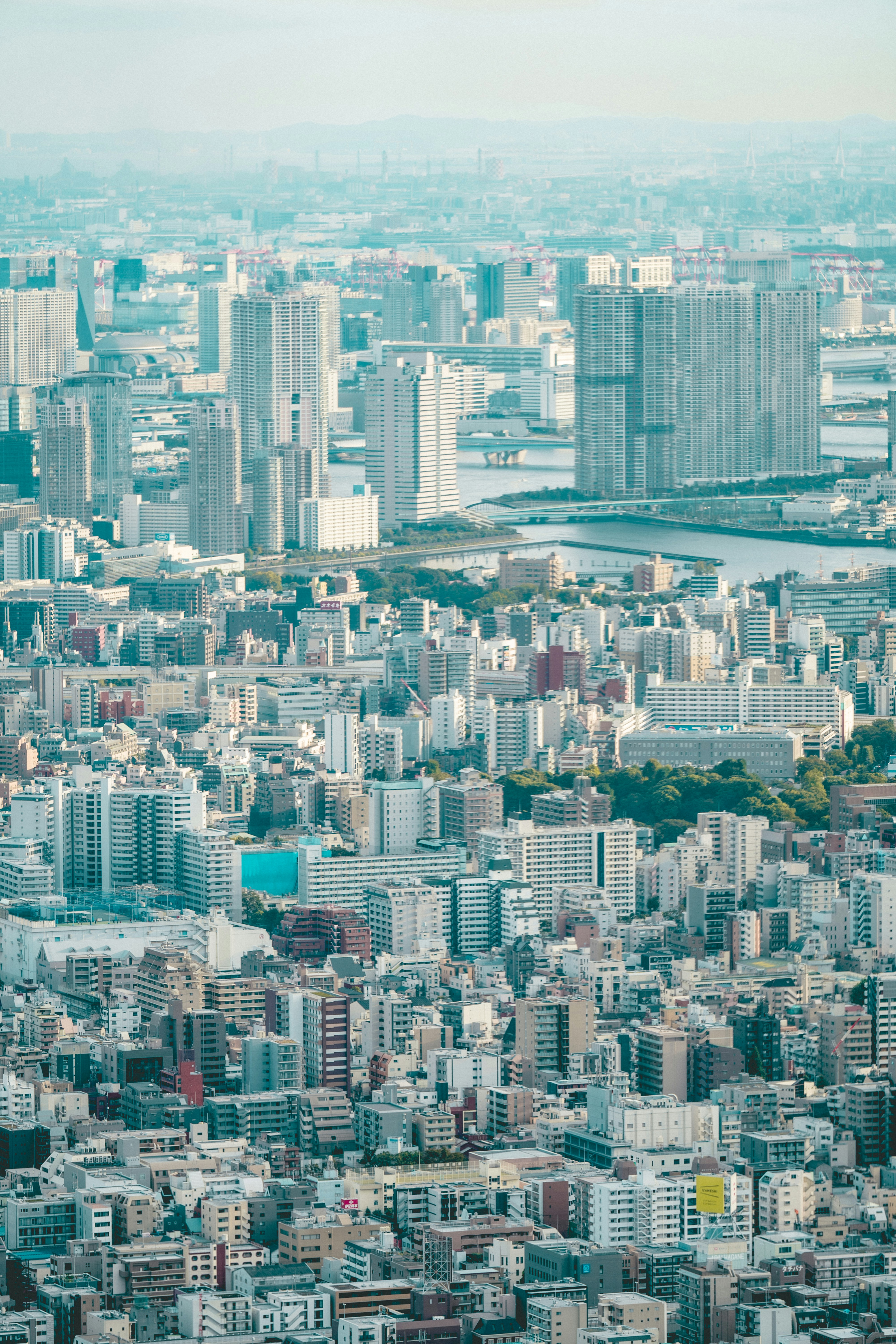 A city with lots of tall buildings and a river photo – Free Building ...