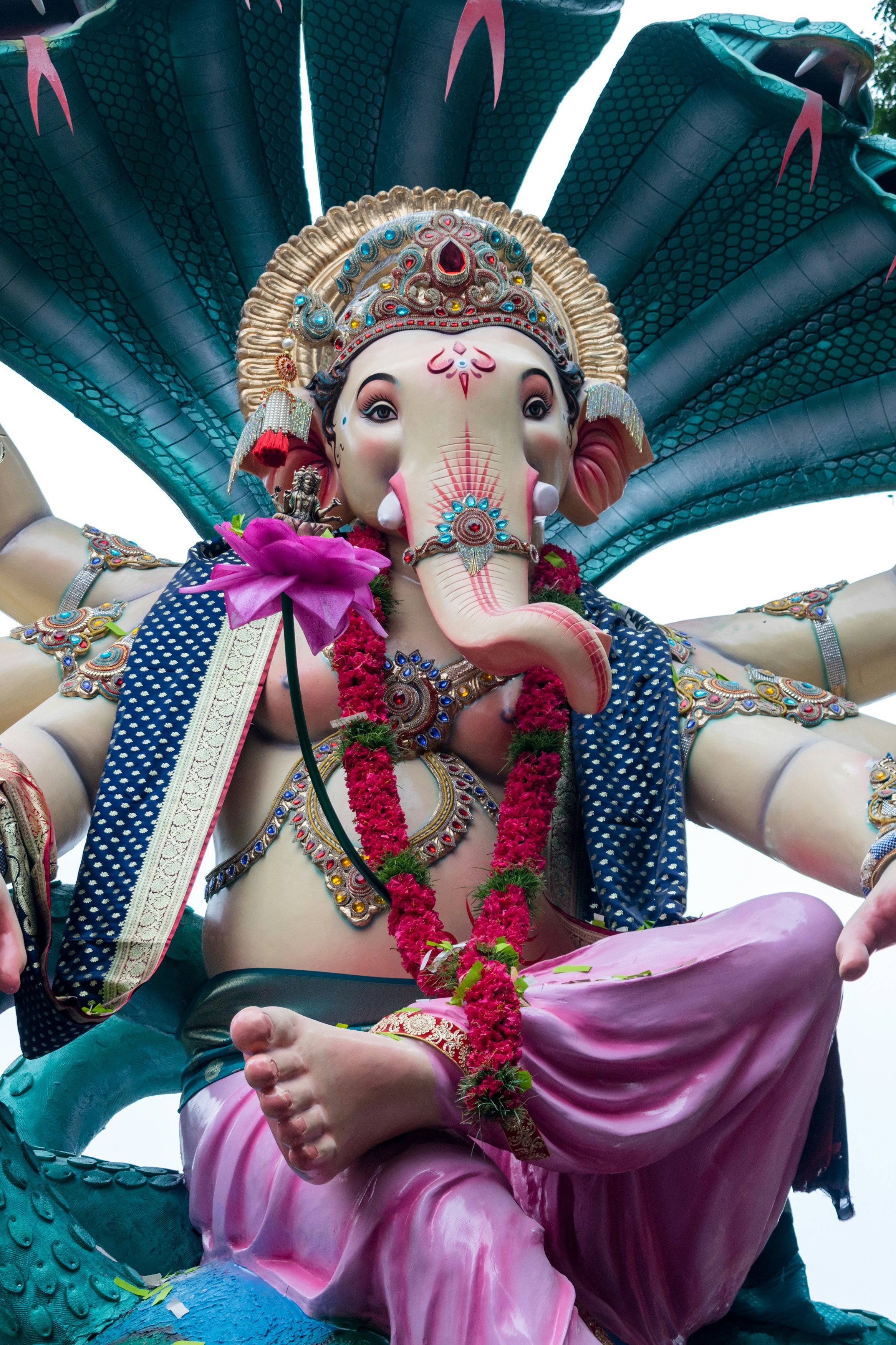 A statue of an indian god sitting on a bench photo – Free Art Image on ...