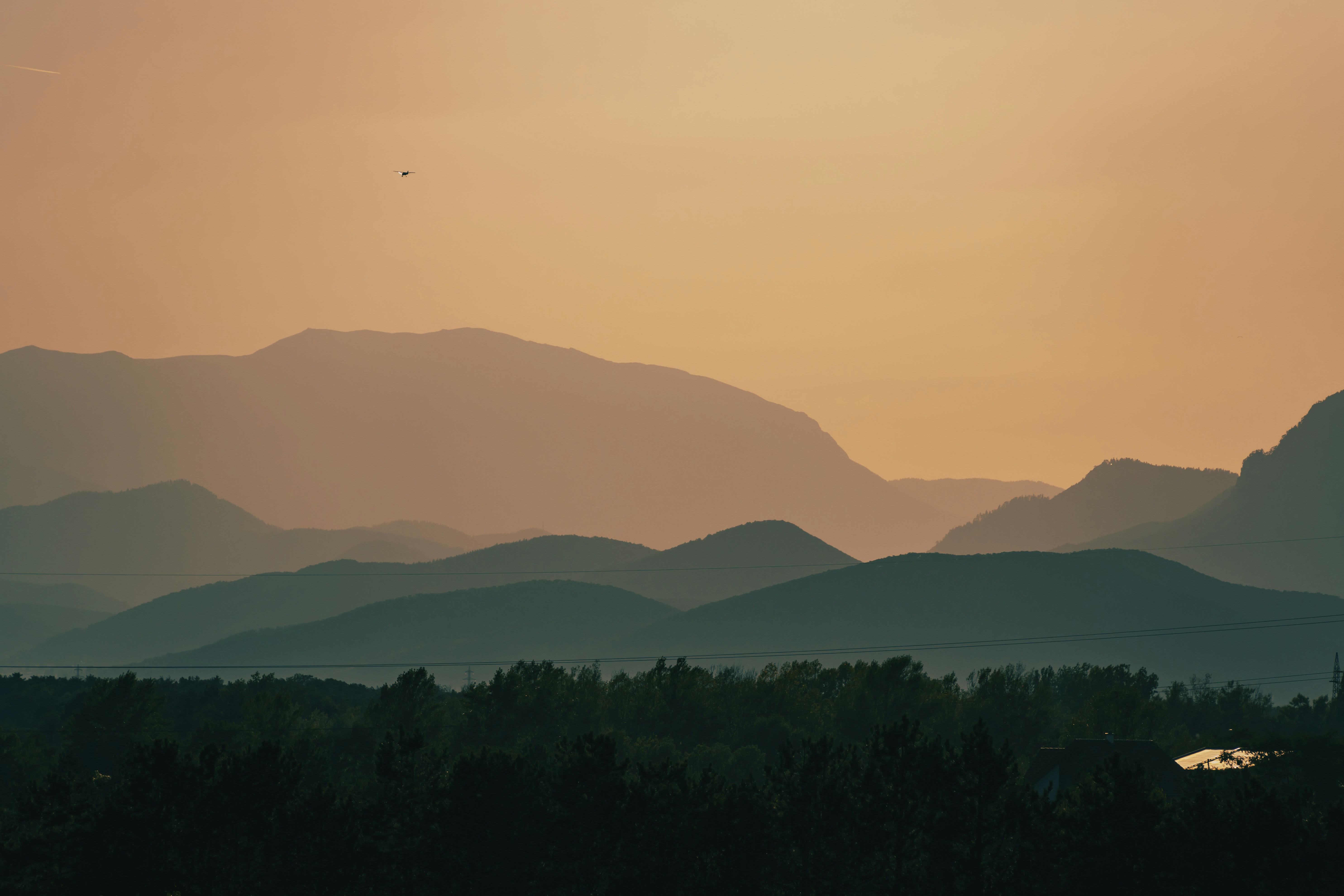 Amber Horizon: Layers of Dusk Over Quiet Mountain Ranges