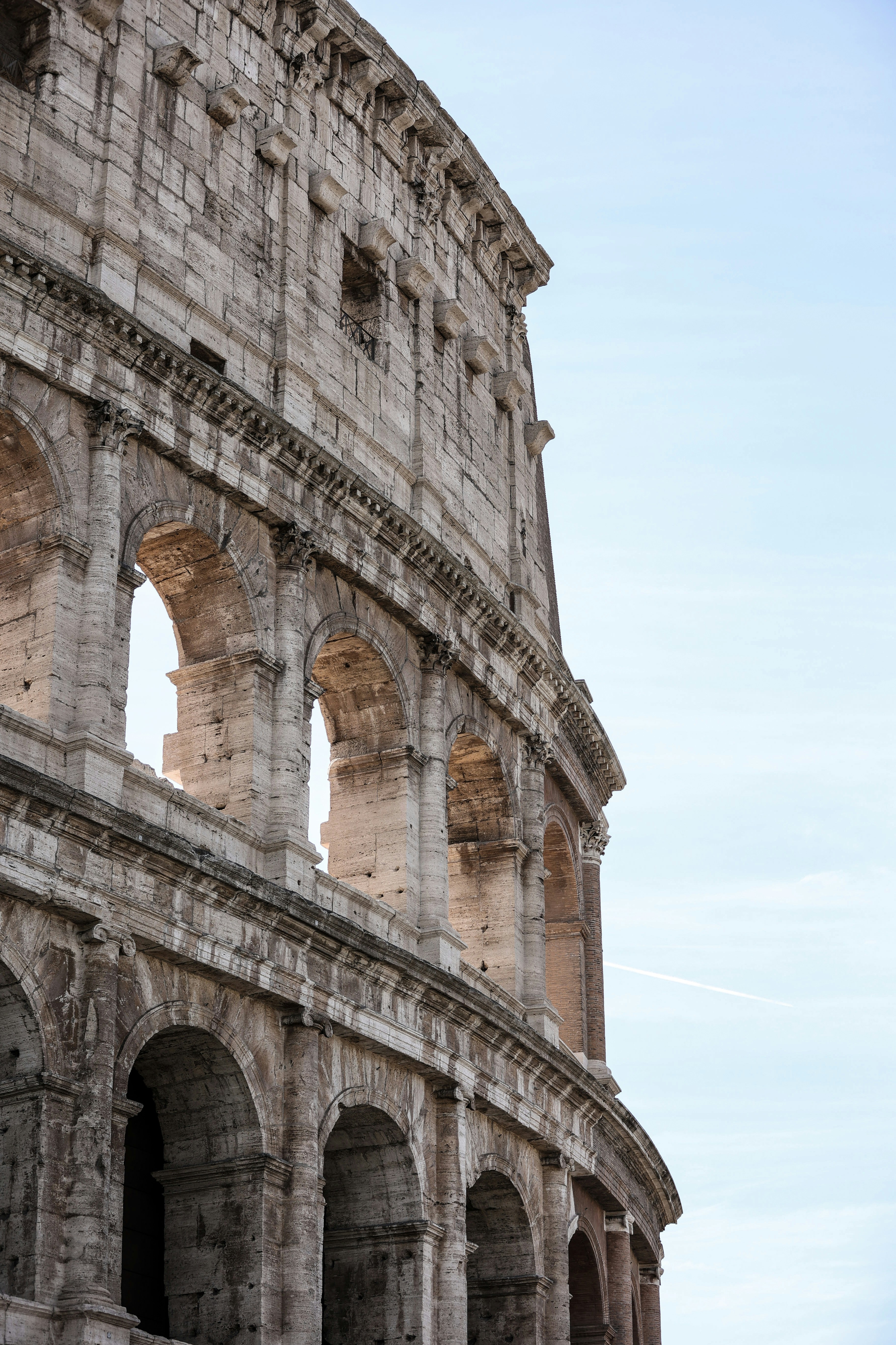 A large stone building with arches and arches photo – Free Colosseum ...