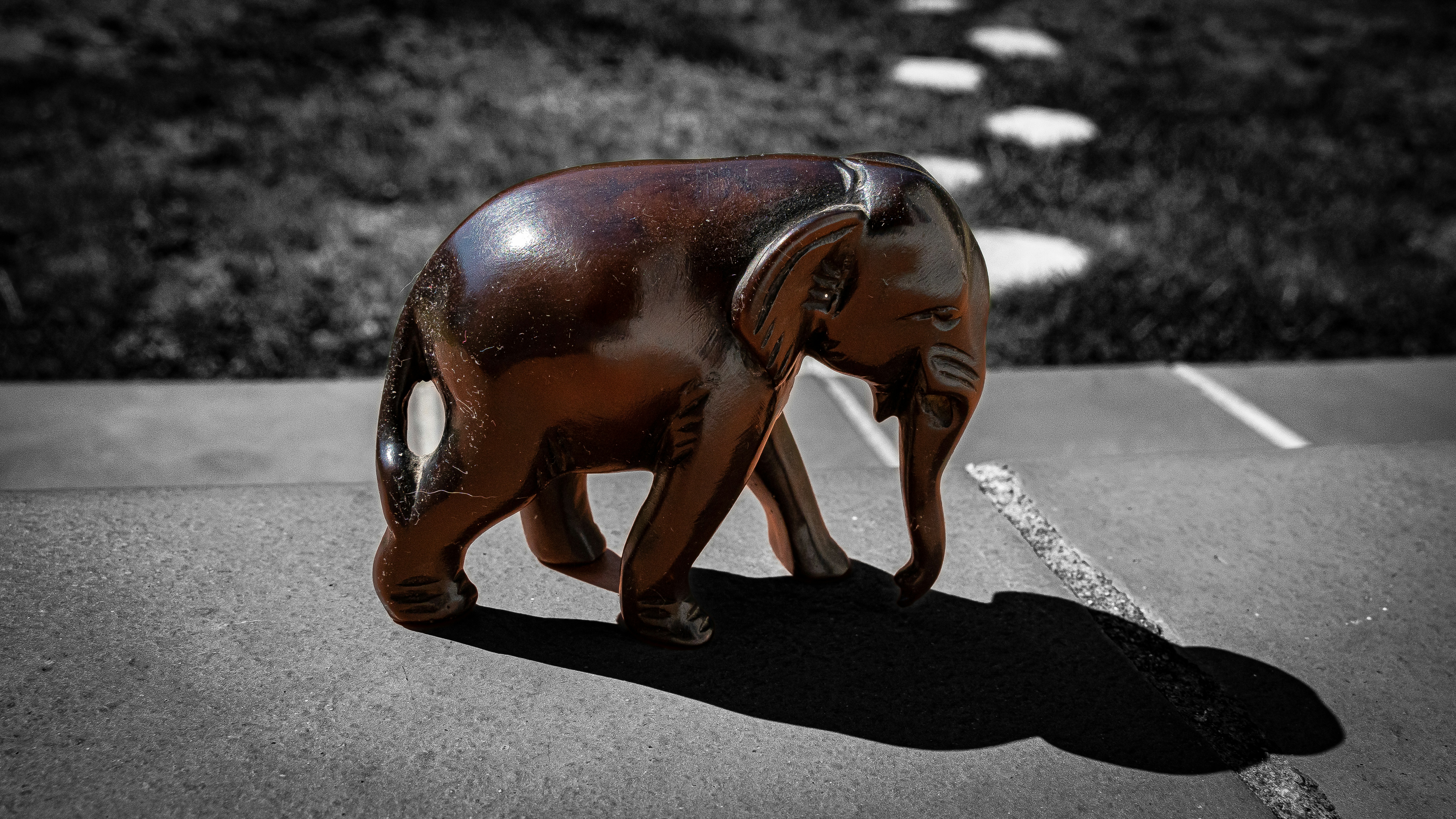 A statue of an elephant casting a shadow on the ground photo – Free ...