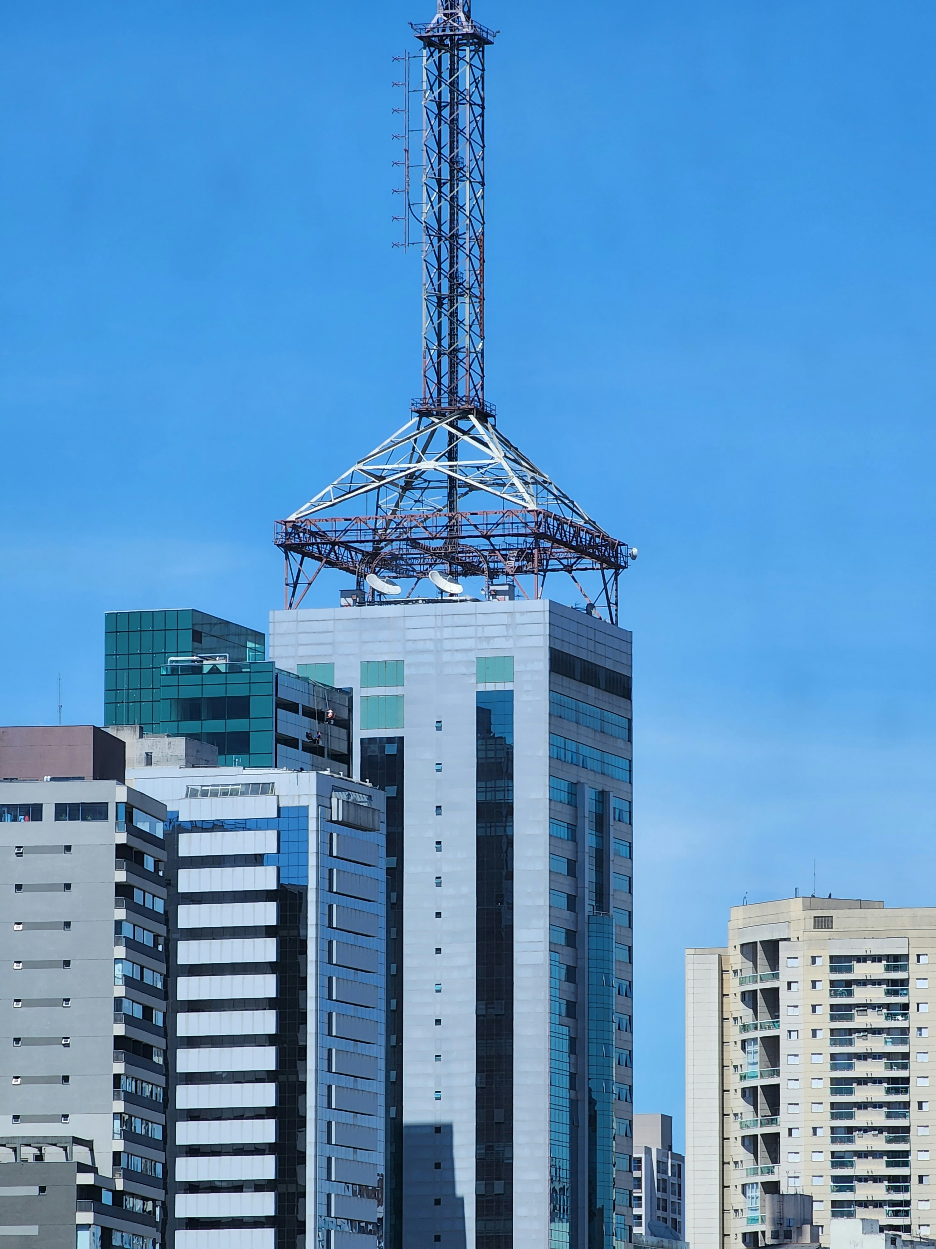 Spire Over the Glass Grid: A City Tower Reaching Skyward