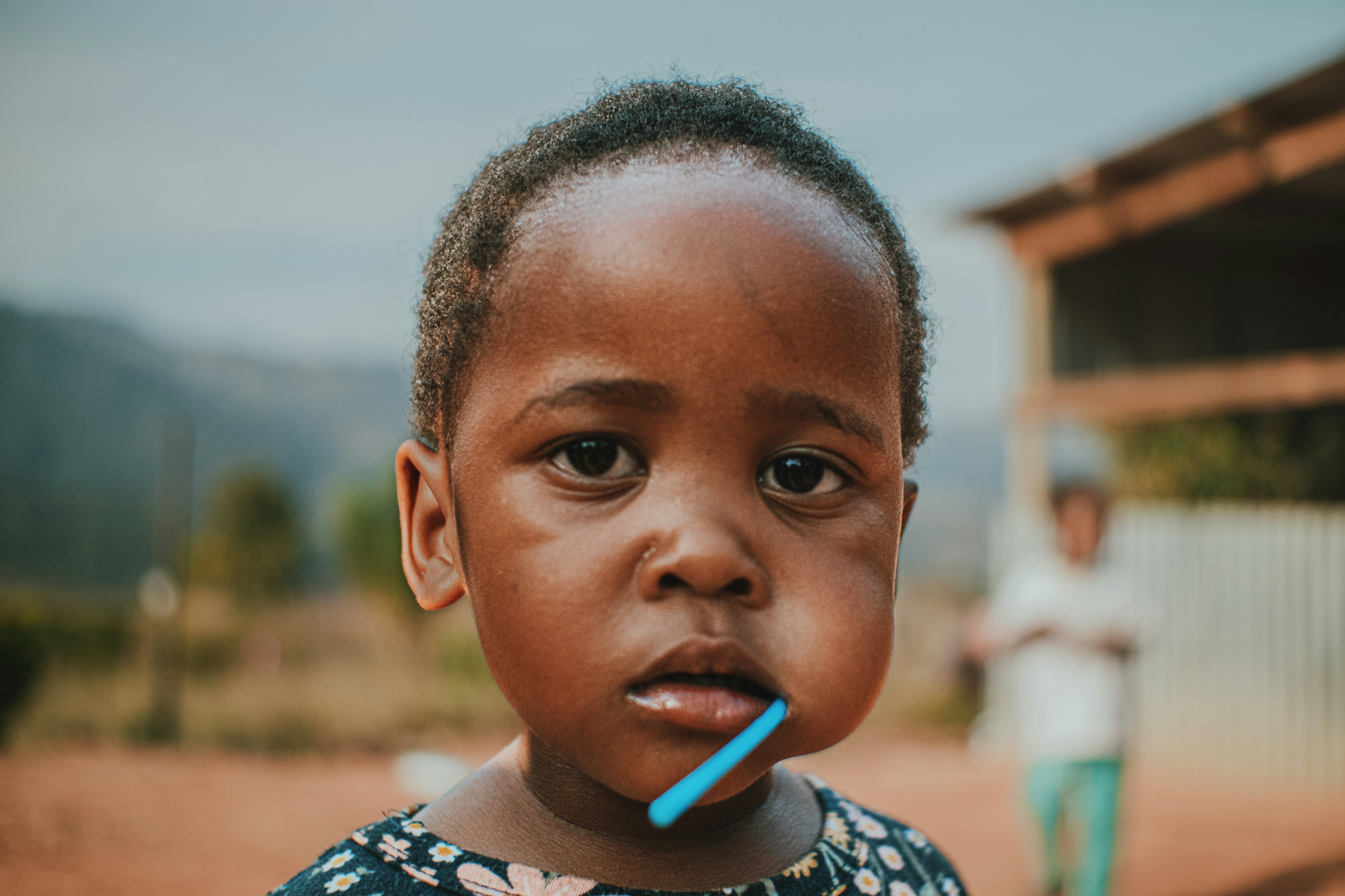 A young girl with a toothbrush in her mouth photo – Free People Image ...