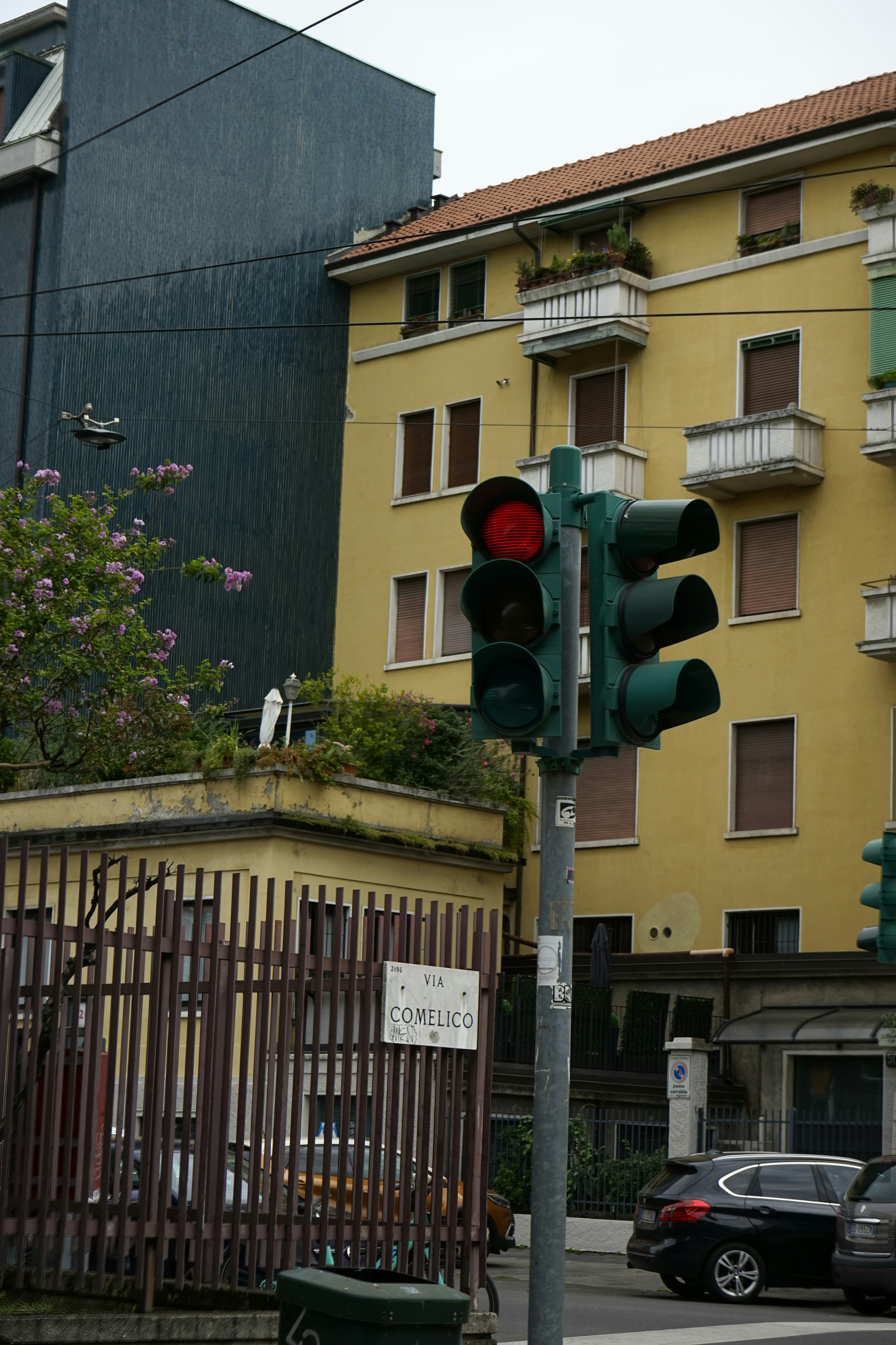 Red Traffic Signal Framing a Sunlit Italian Street