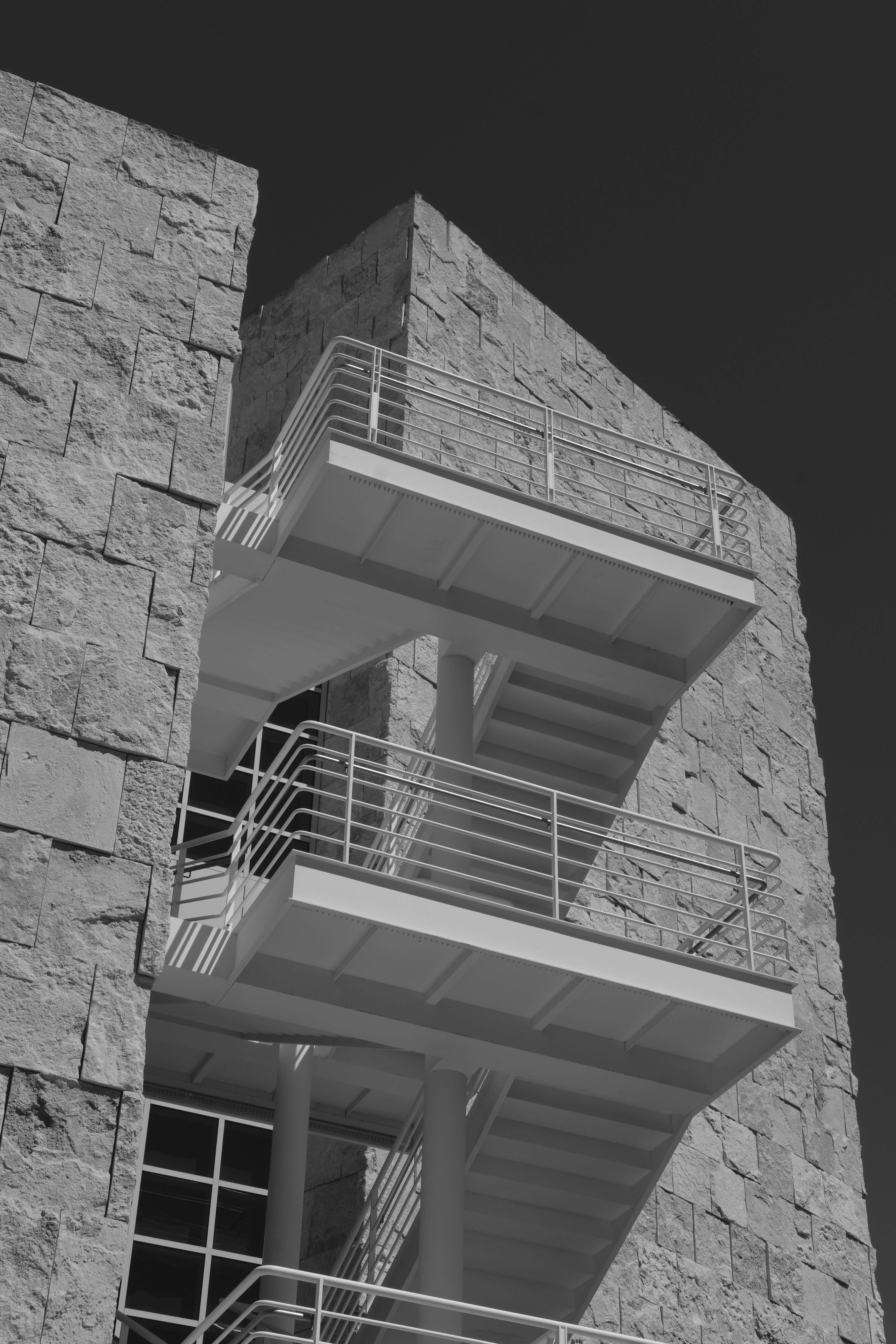 Geometric Ascension Along a Stone Facade