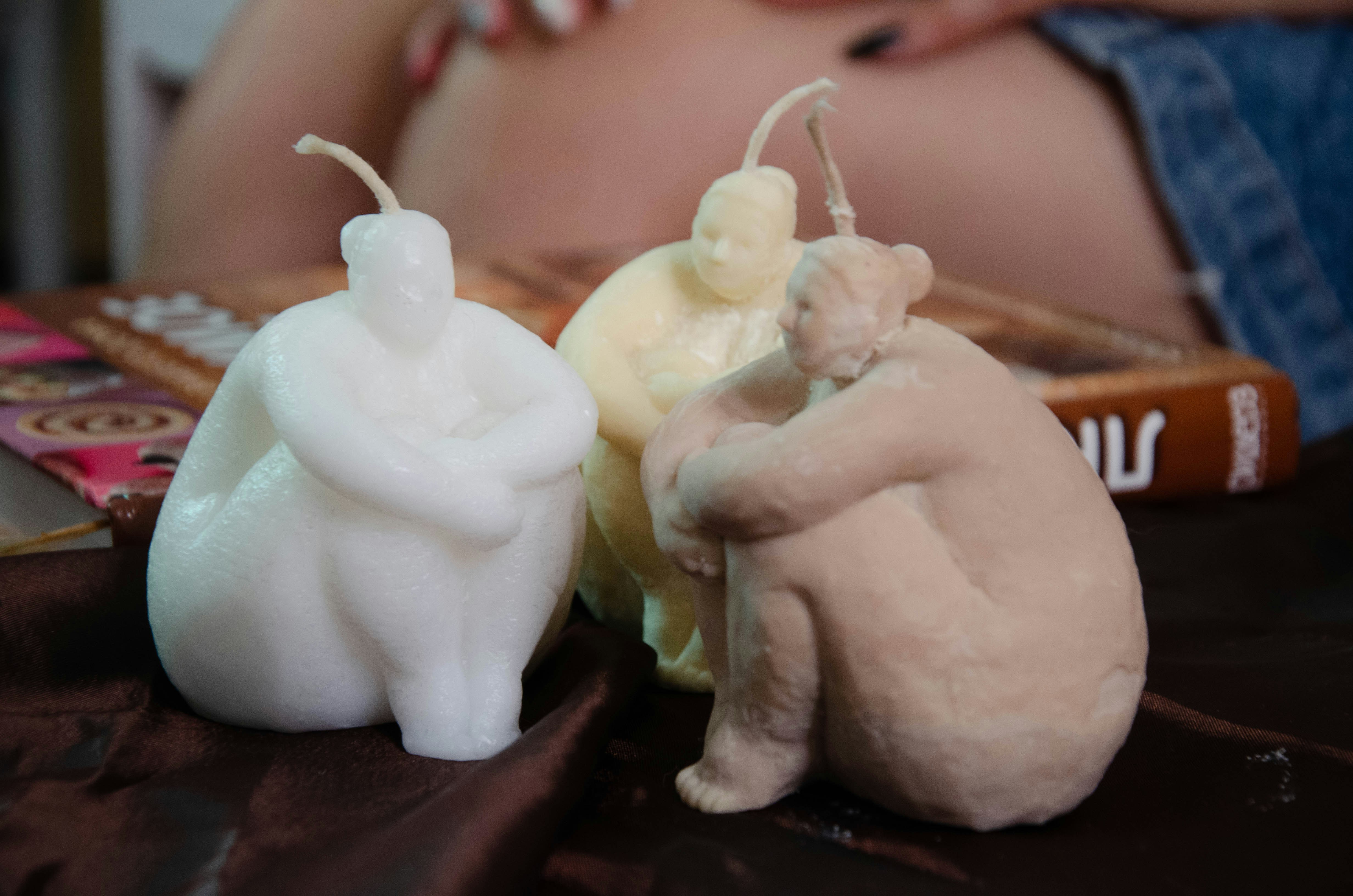 a couple of small figurines sitting on top of a table