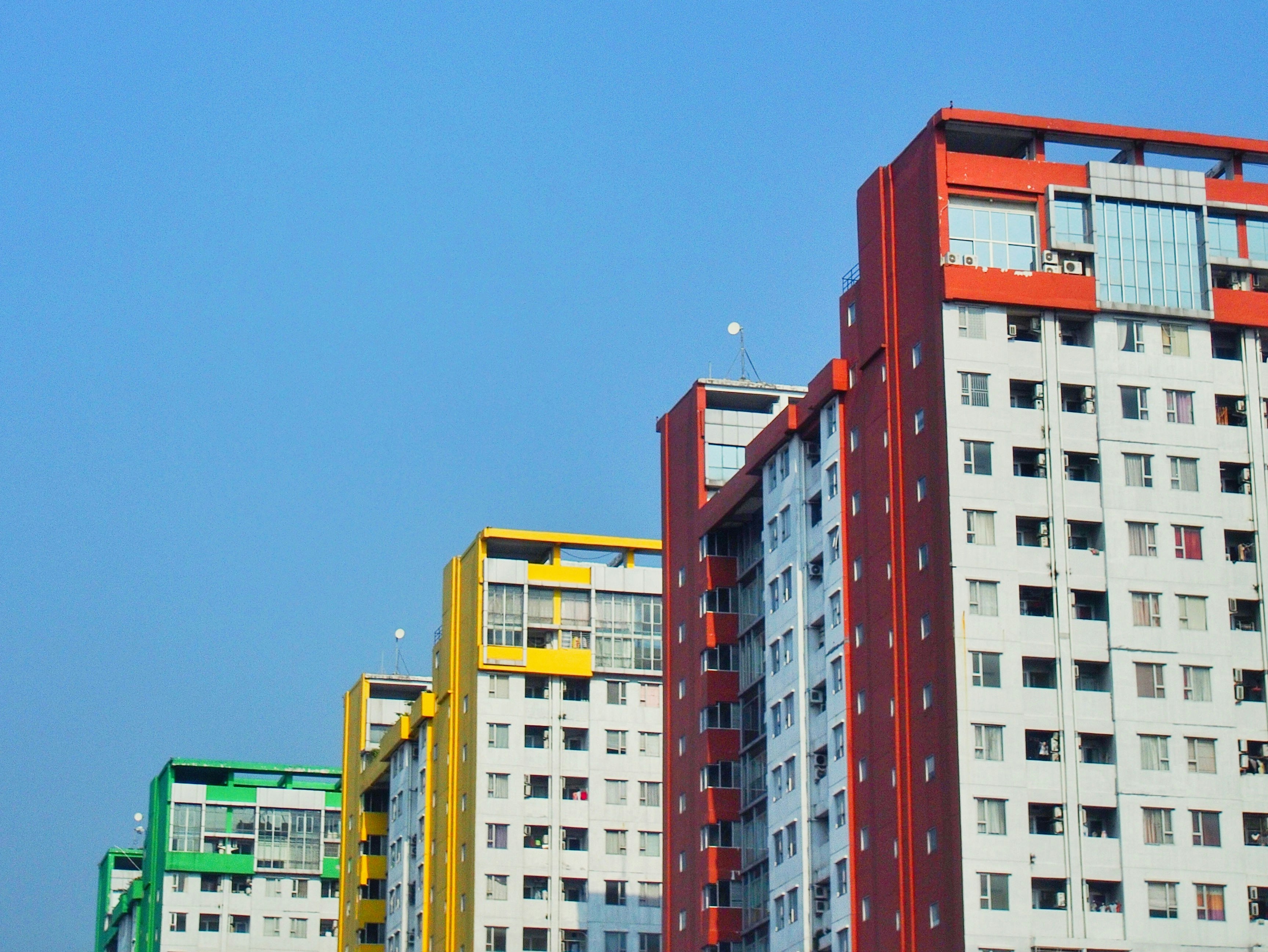 A row of multicolored buildings in a city photo – Free Indonesia Image ...