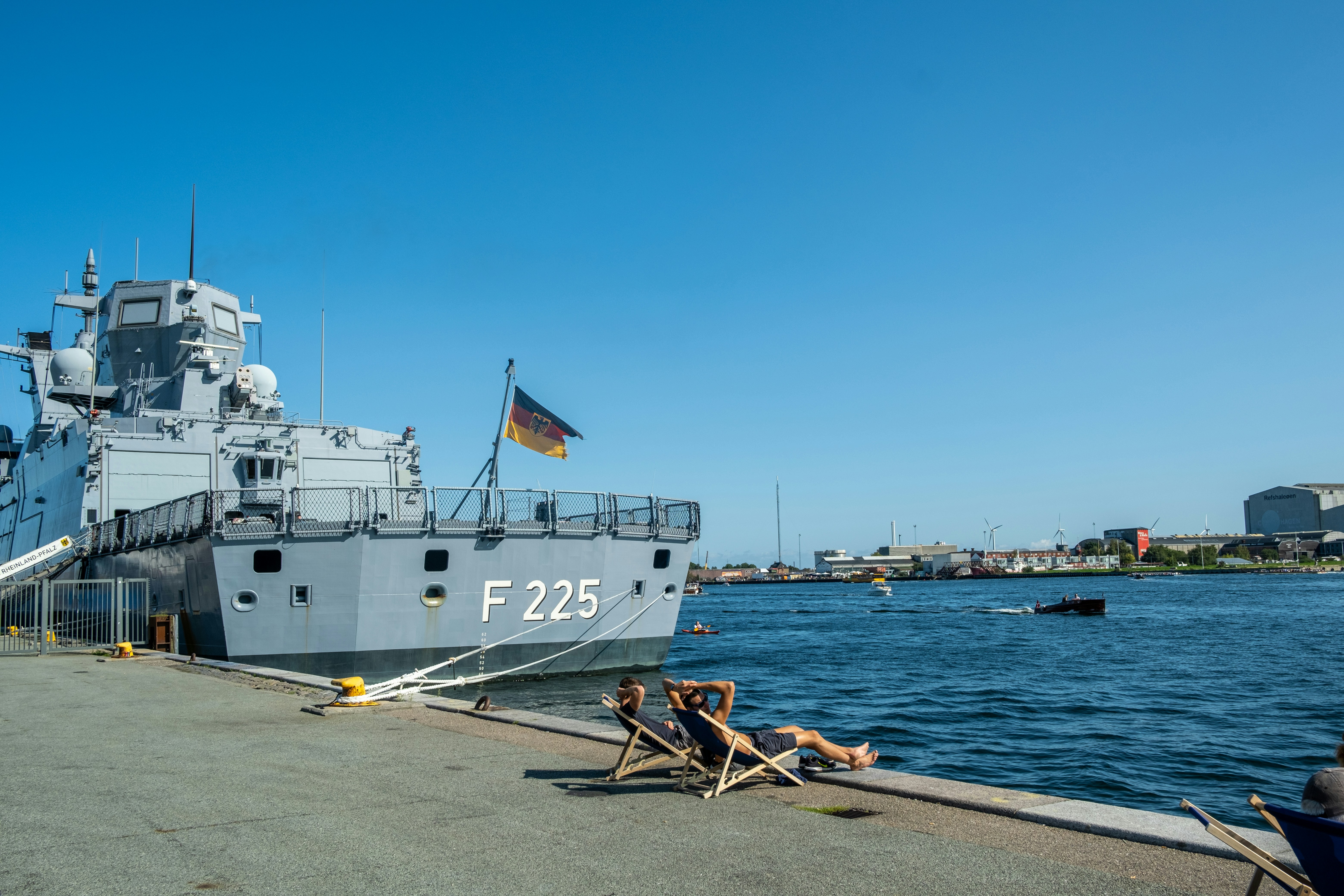 Harbor Serenity: A Naval Presence Amidst Leisure