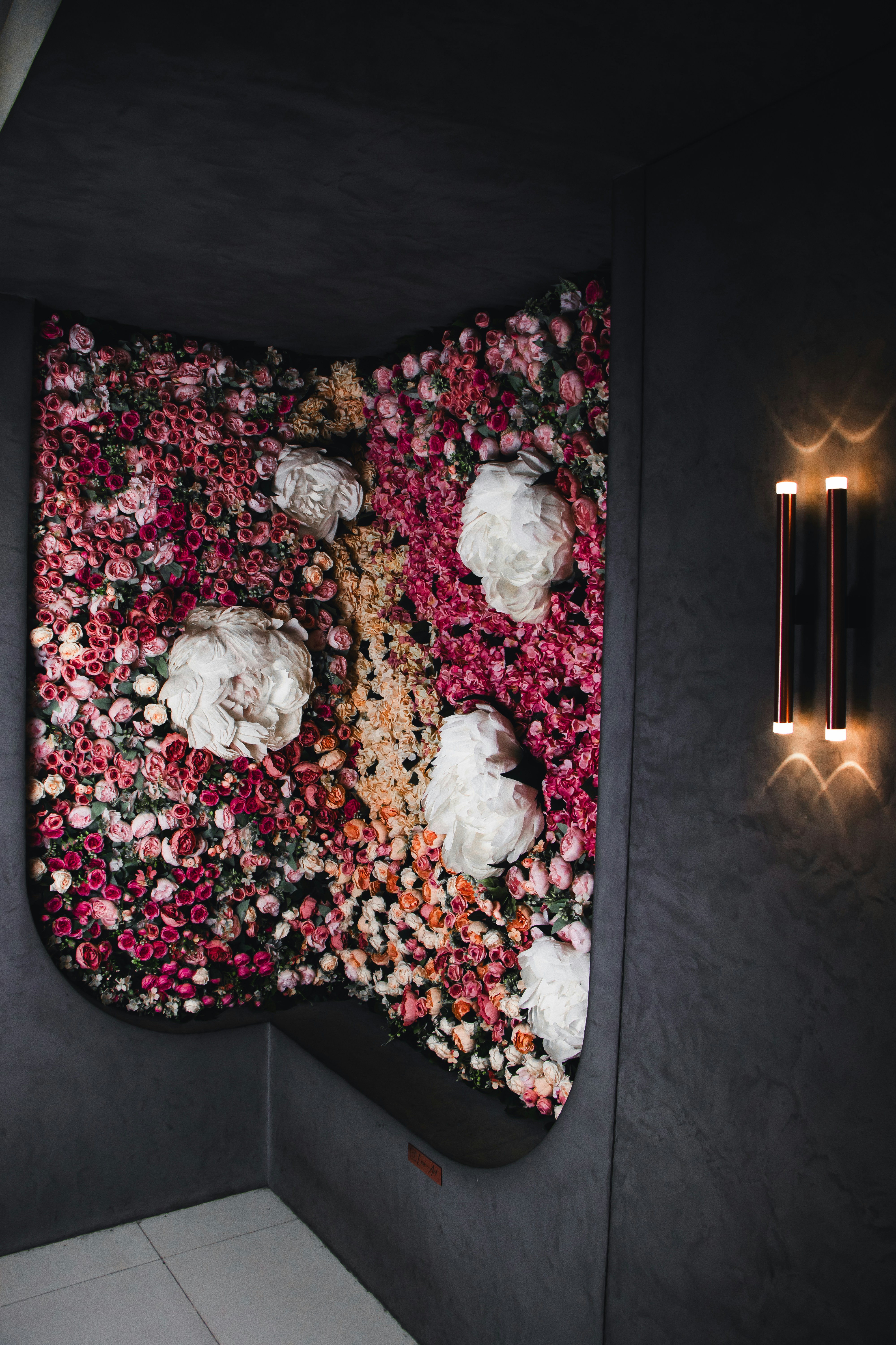 Floral Archway in a Dim Corridor with Accent Lighting