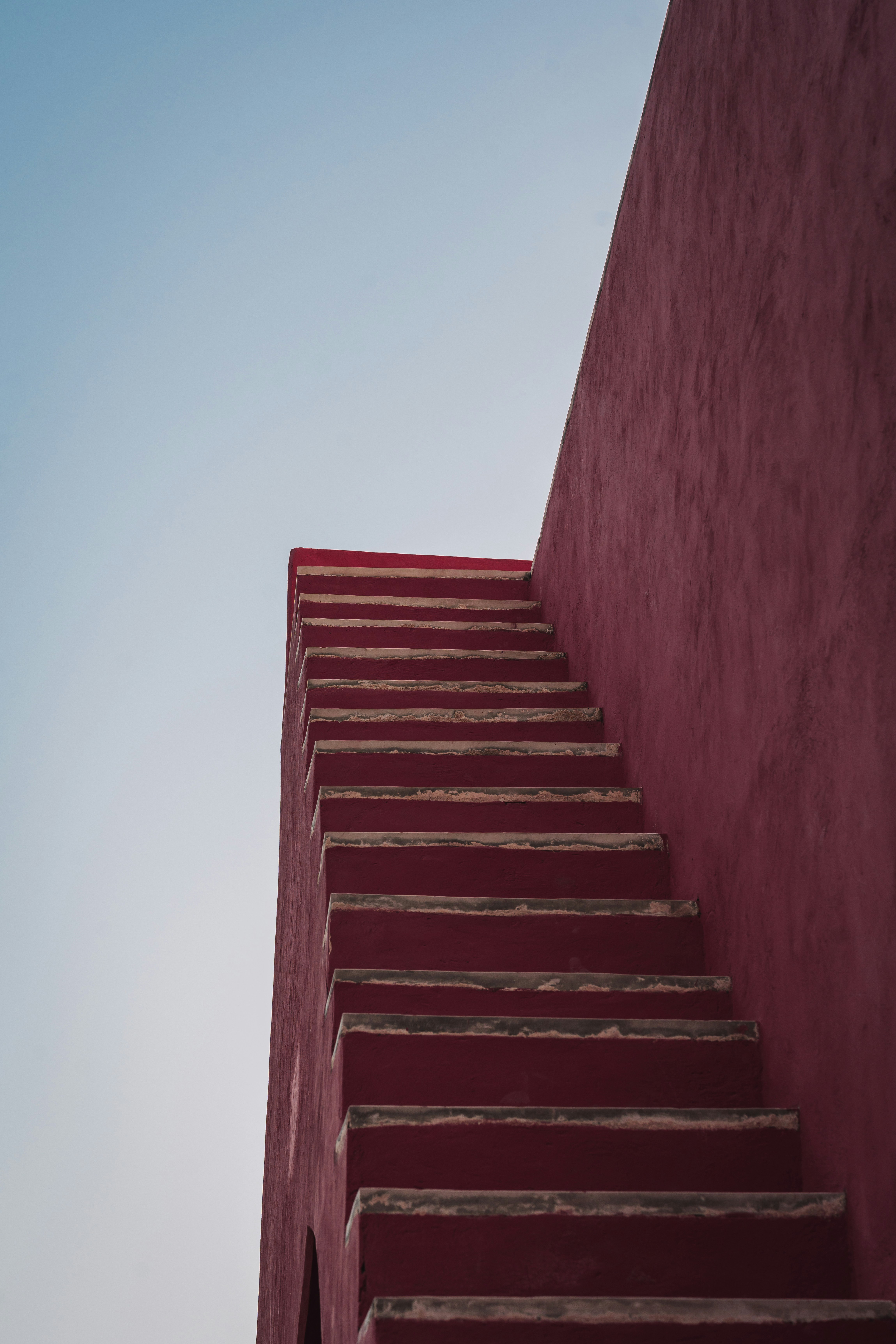 A set of stairs leading up to a building photo – Free Red stairs Image ...