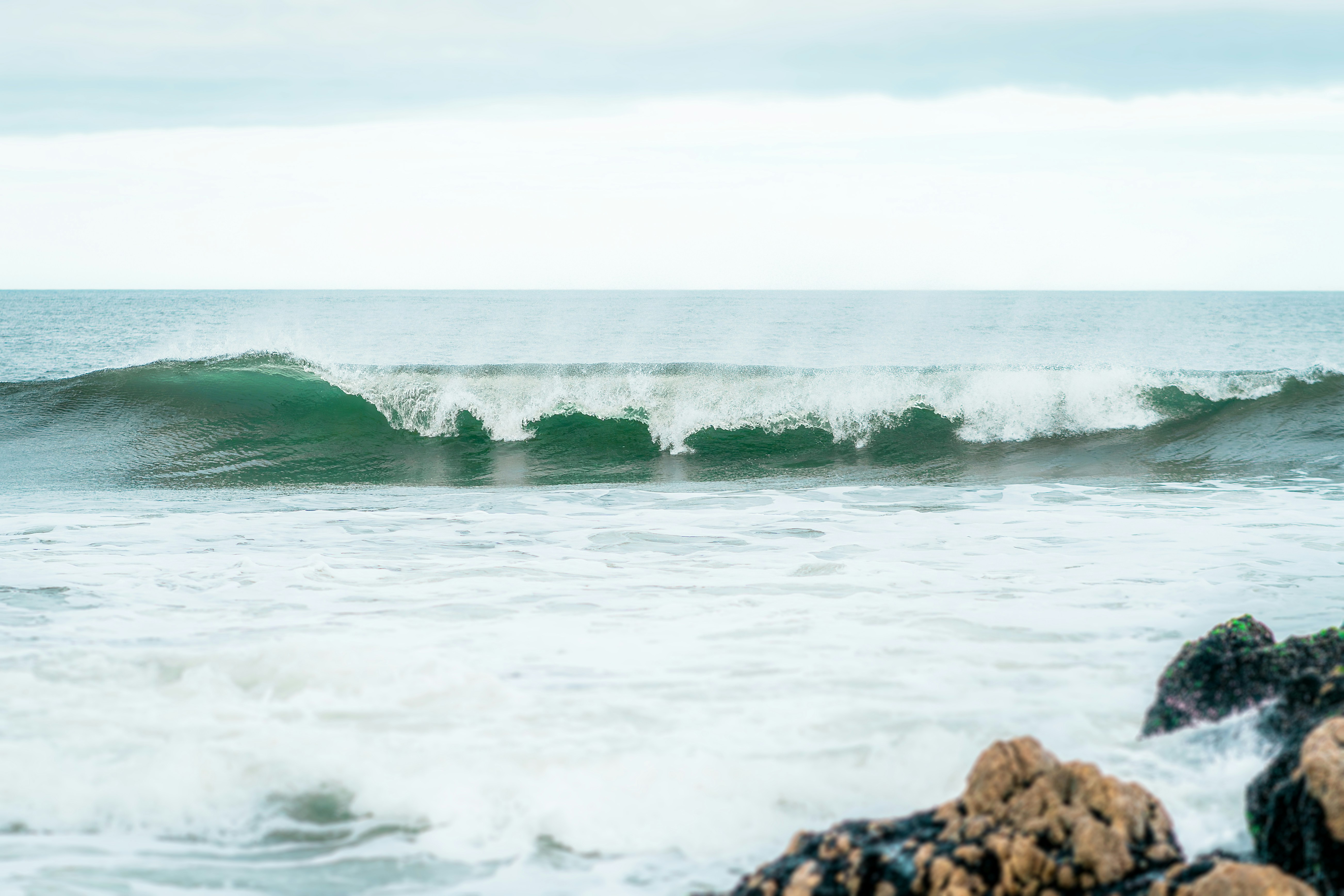 A view of a wave coming in from the ocean photo – Free Uruguay Image on ...