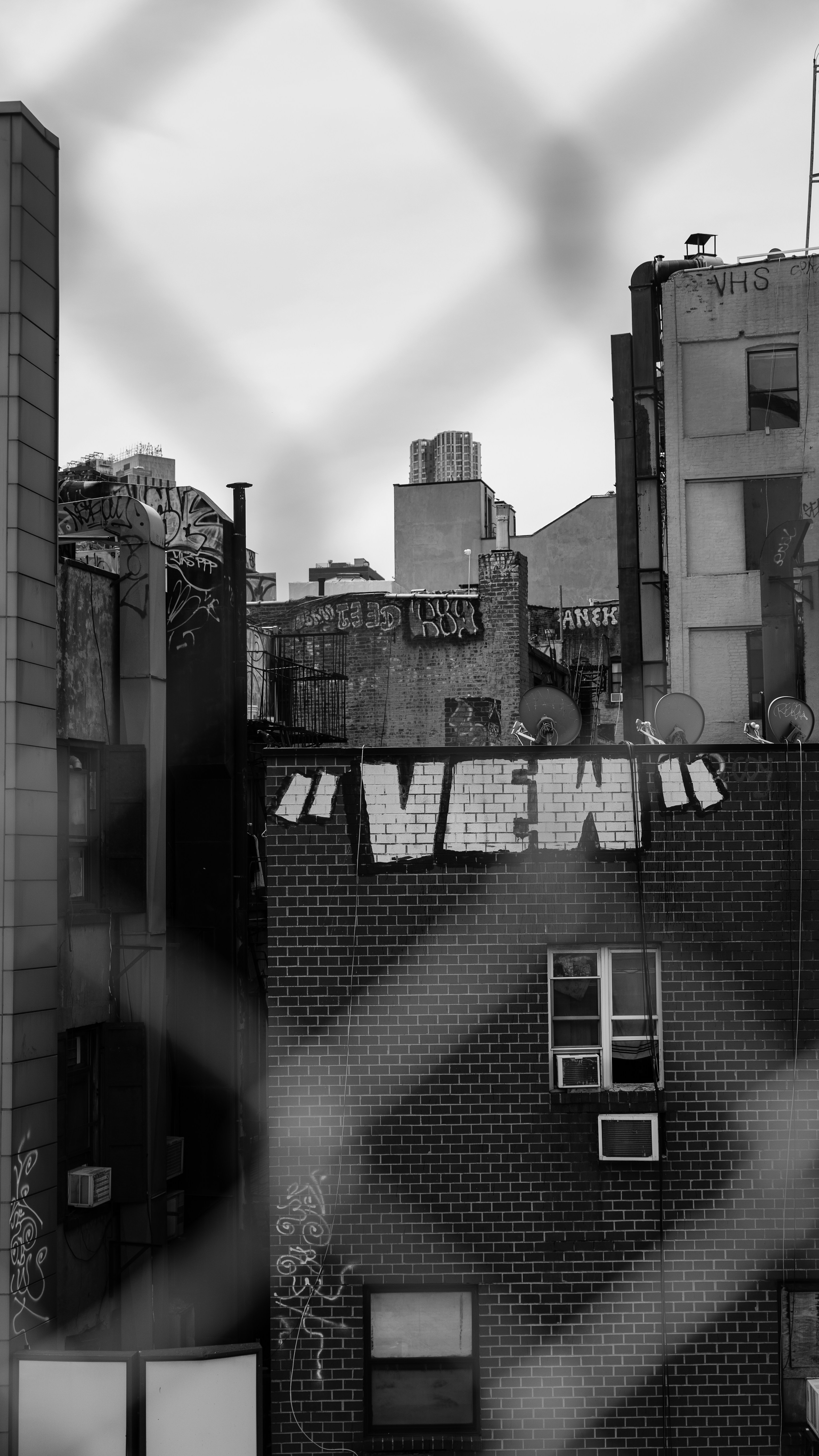Cityscape through Chain-Link Veil