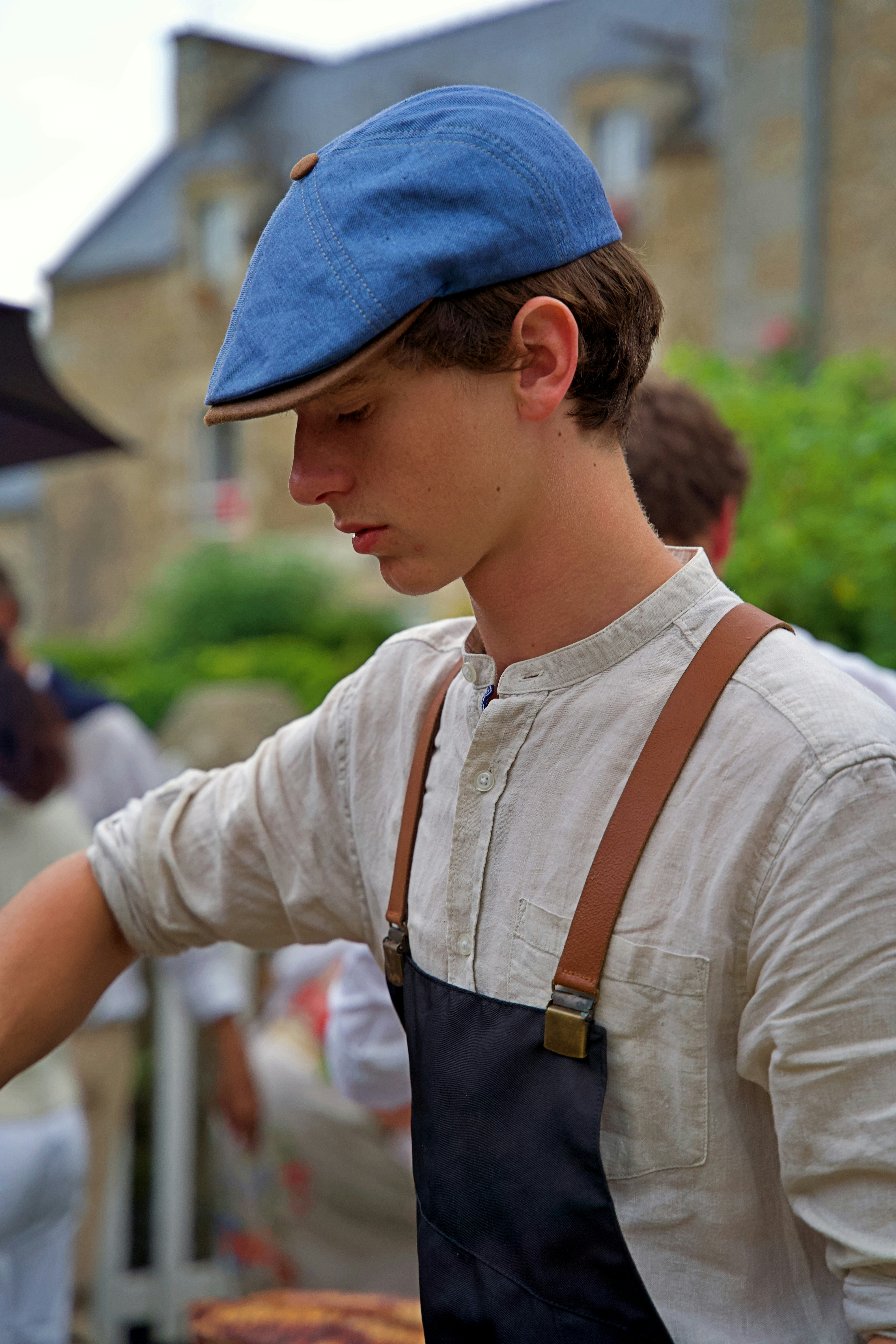 Blue Cap, Leather Straps, and Quiet Craft at a Village Market