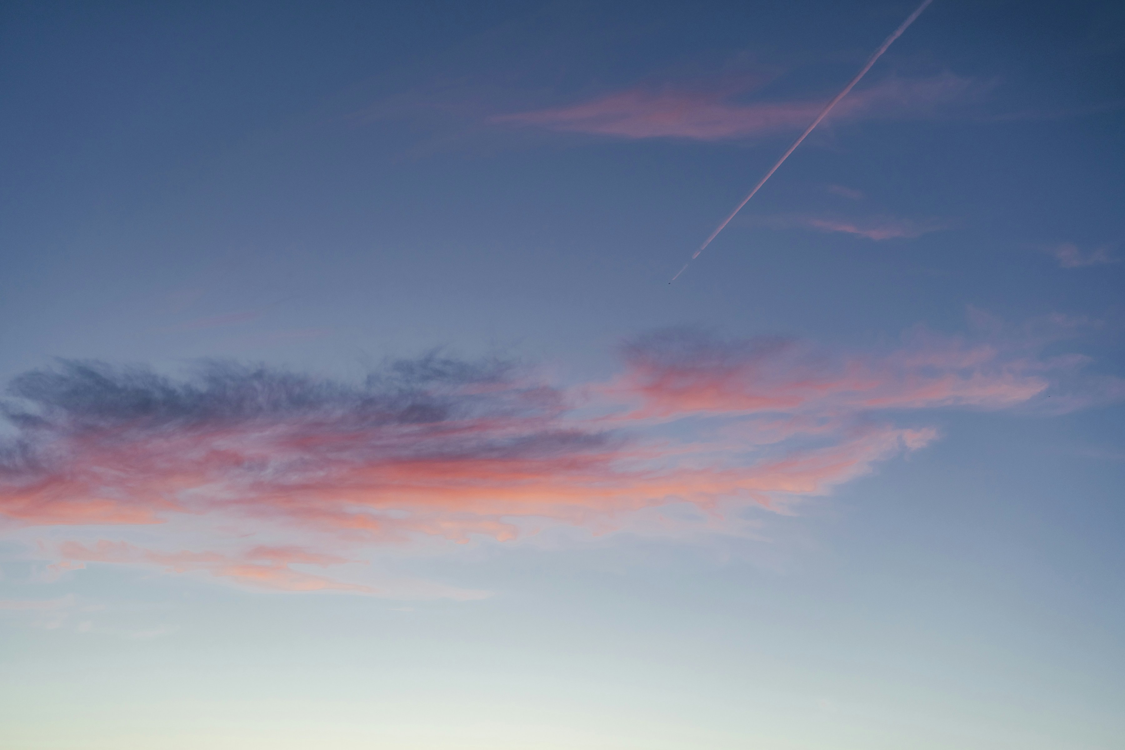 A plane is flying in the sky at sunset photo – Free Nature Image on ...