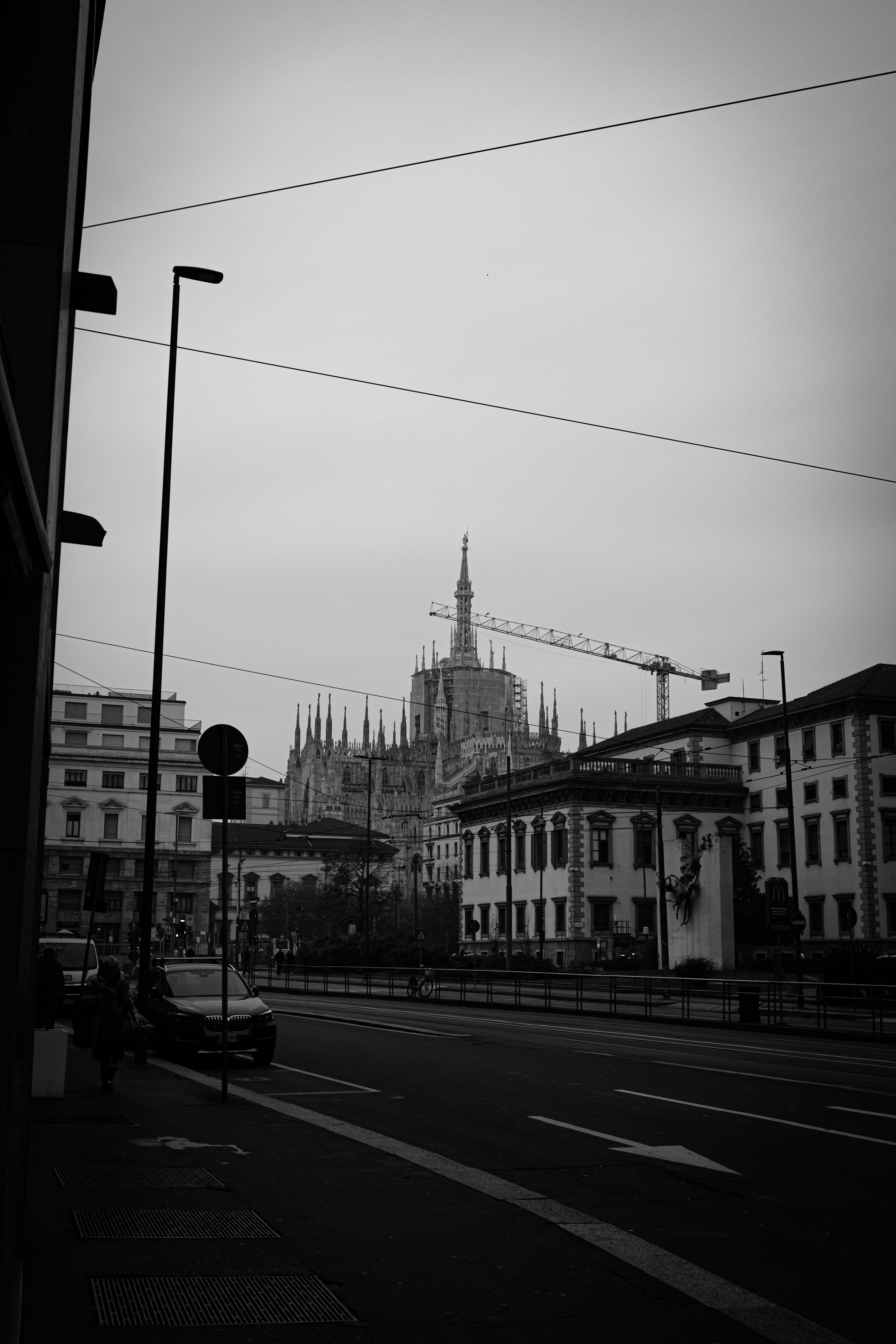 Duomo Framed by a Quiet Boulevard in Monochrome