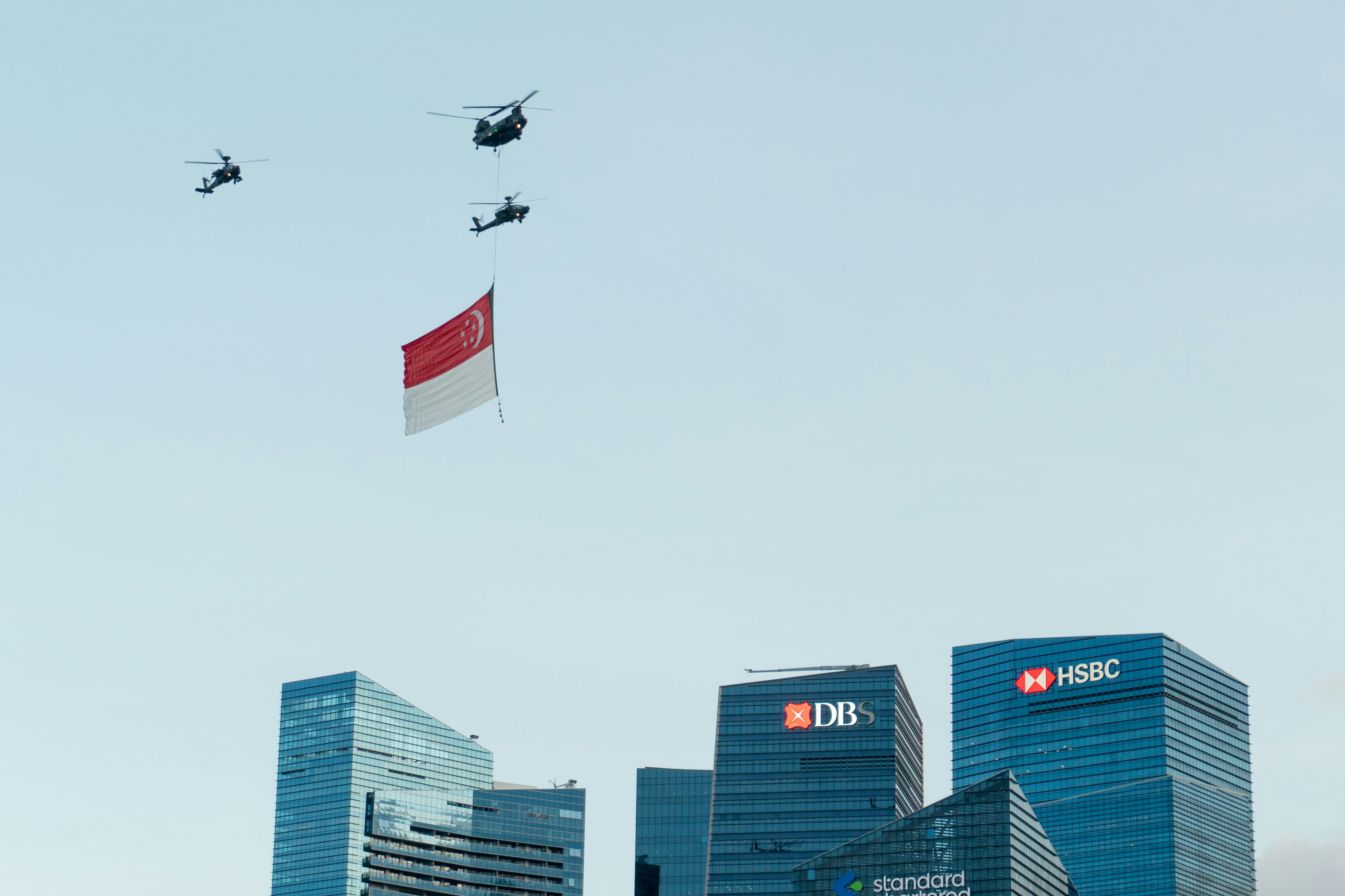 Aerial Tribute: Singapore's Flag in the Urban Sky