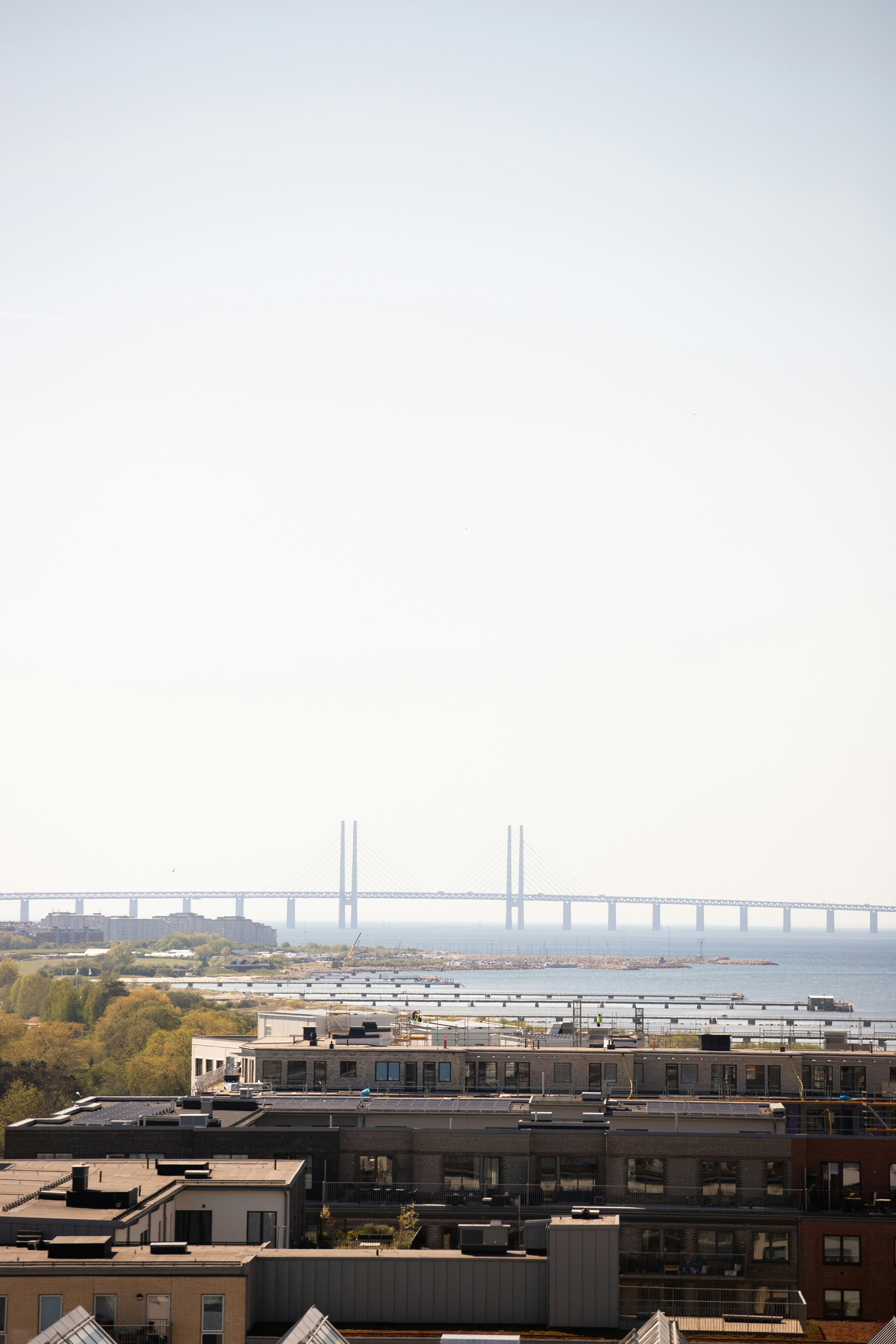 A train traveling over a bridge over a large body of water photo – Free ...