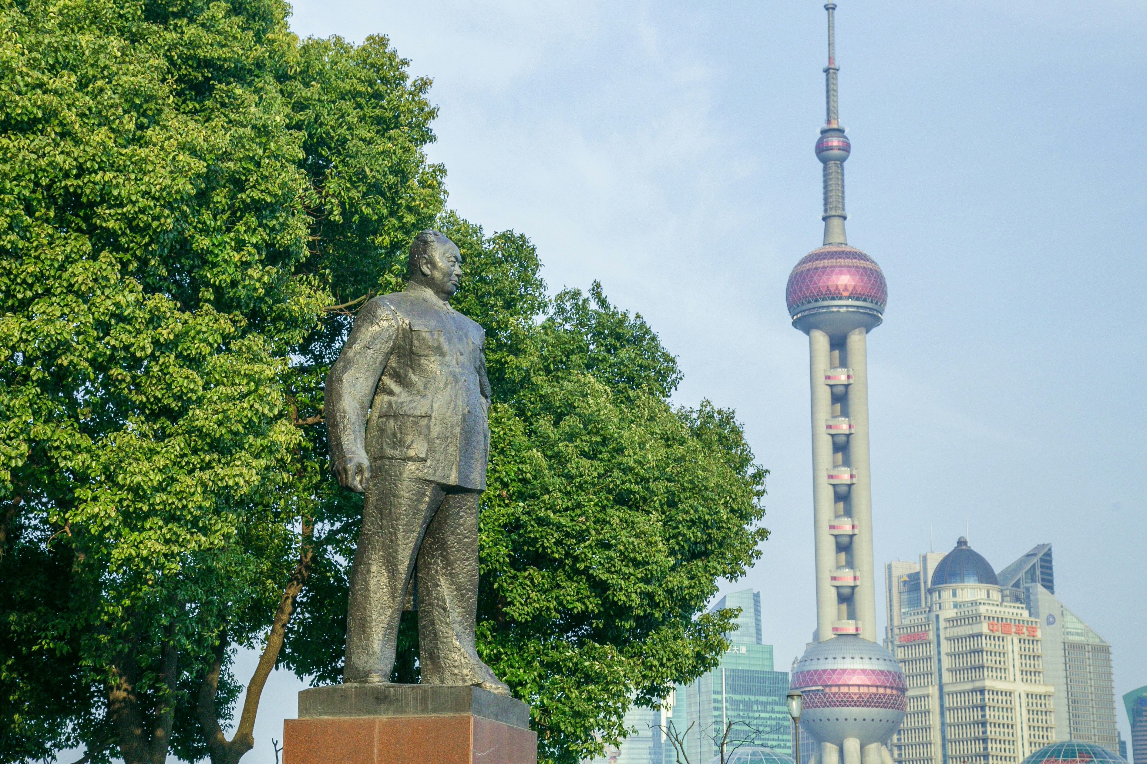 Bronze Sentinel Against Shanghai's Glass Horizon