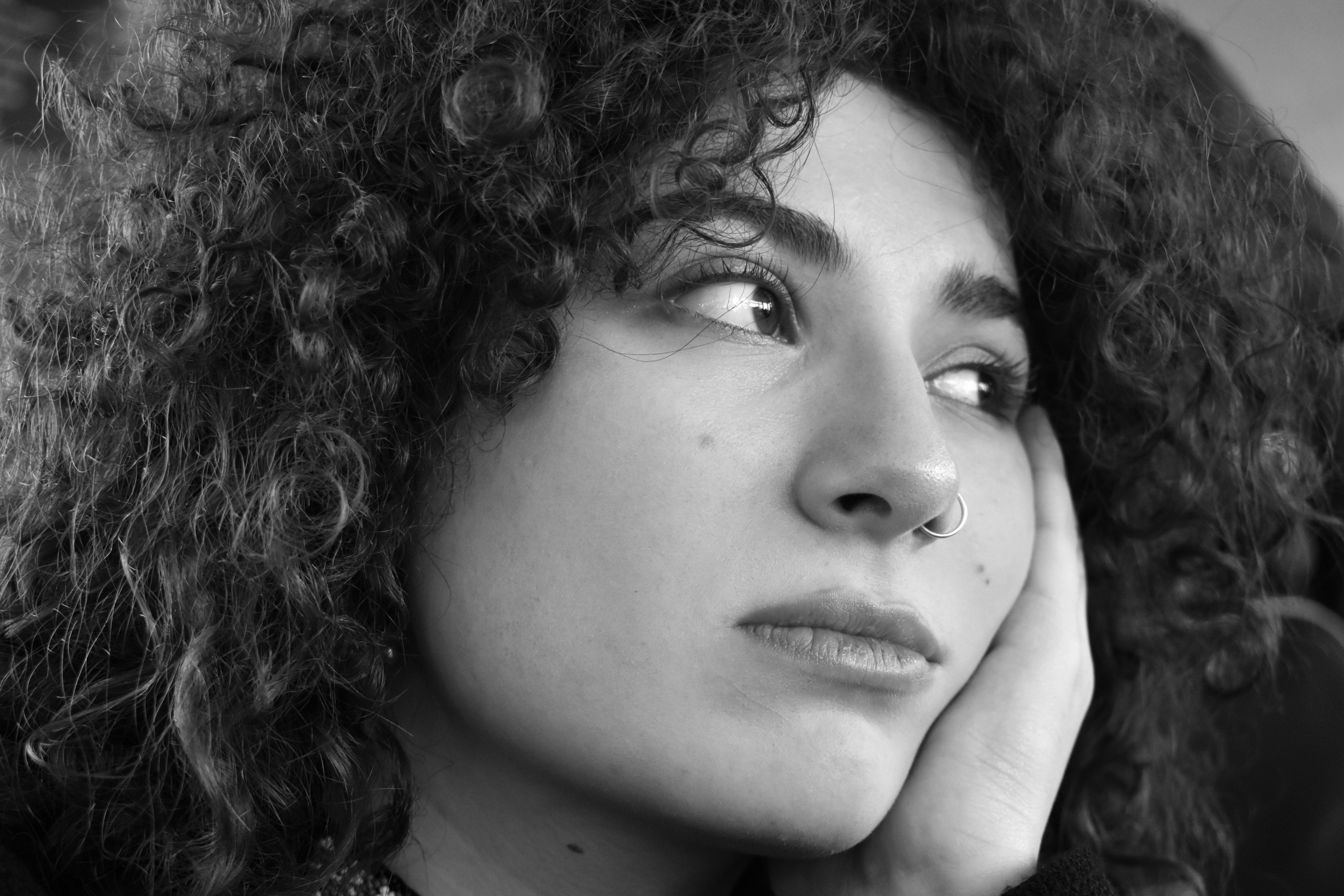 A black and white photo of a woman with curly hair photo – Free Curly ...