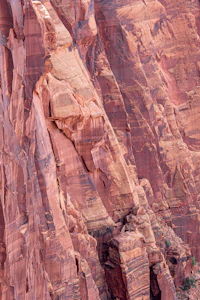 Crimson Veins: Layered Canyon Faces Shaped by Time