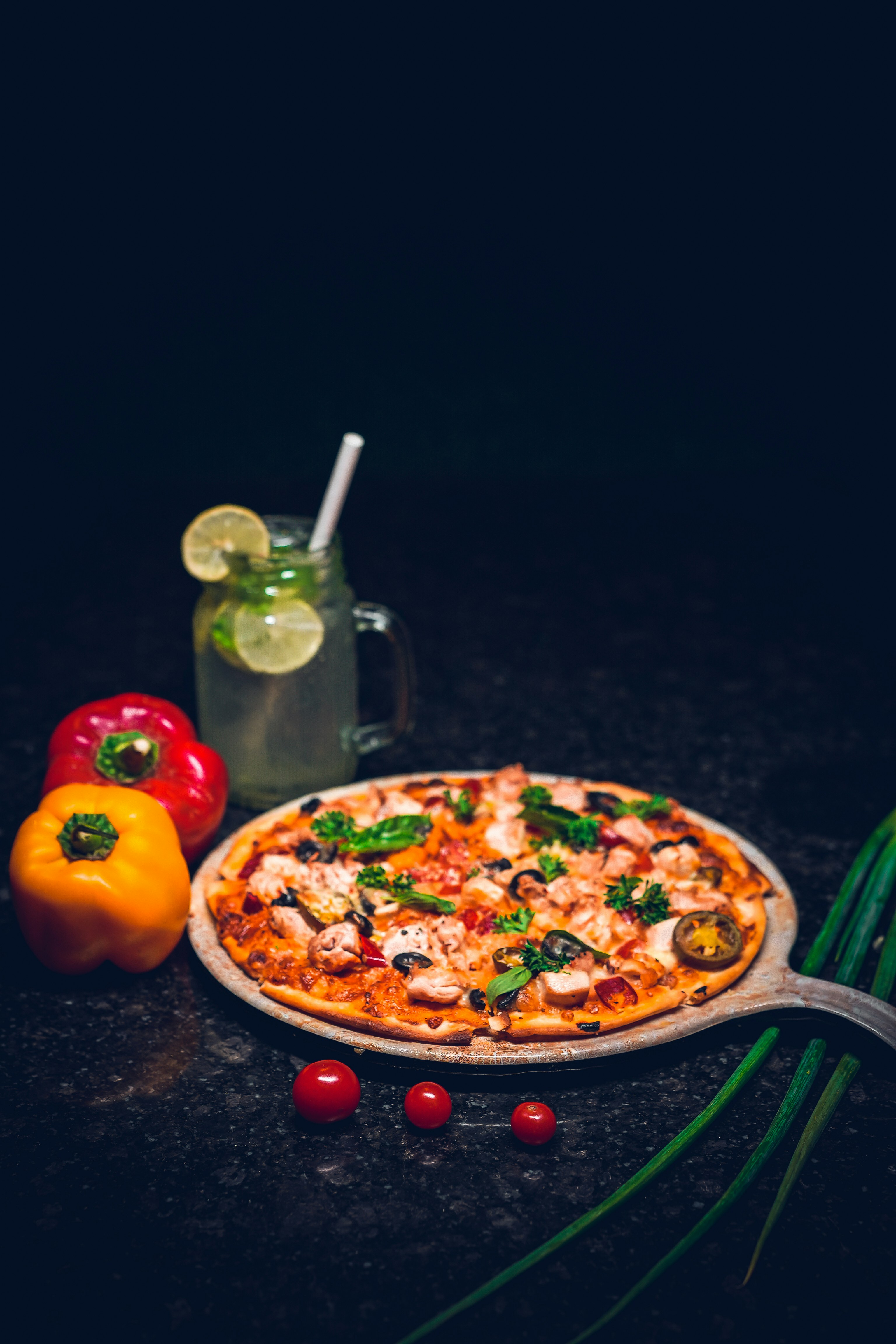 Midnight Crisp: Pepper-Topped Pizza with Neon Greens