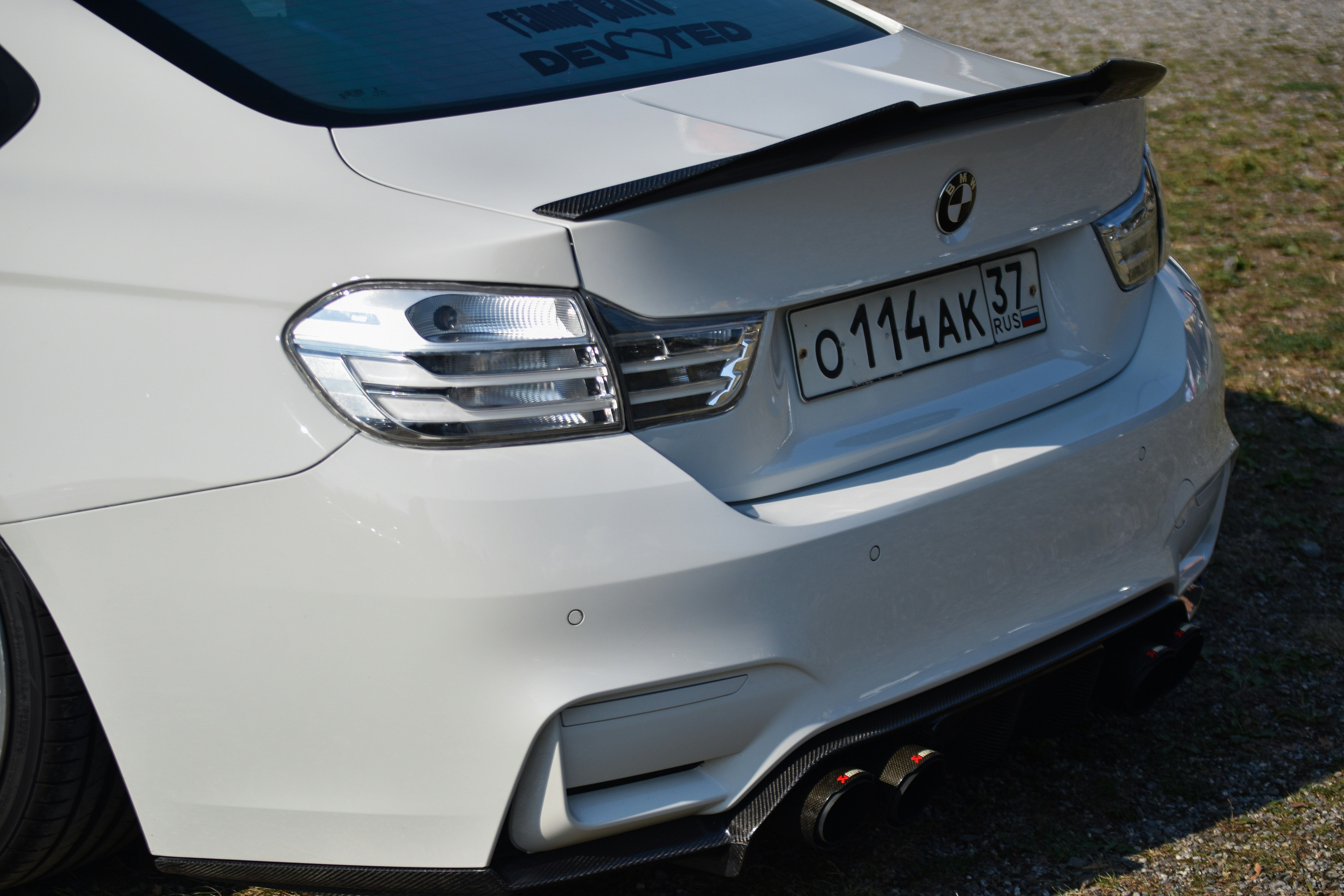A close up of a white car with a license plate photo – Free Car Image ...