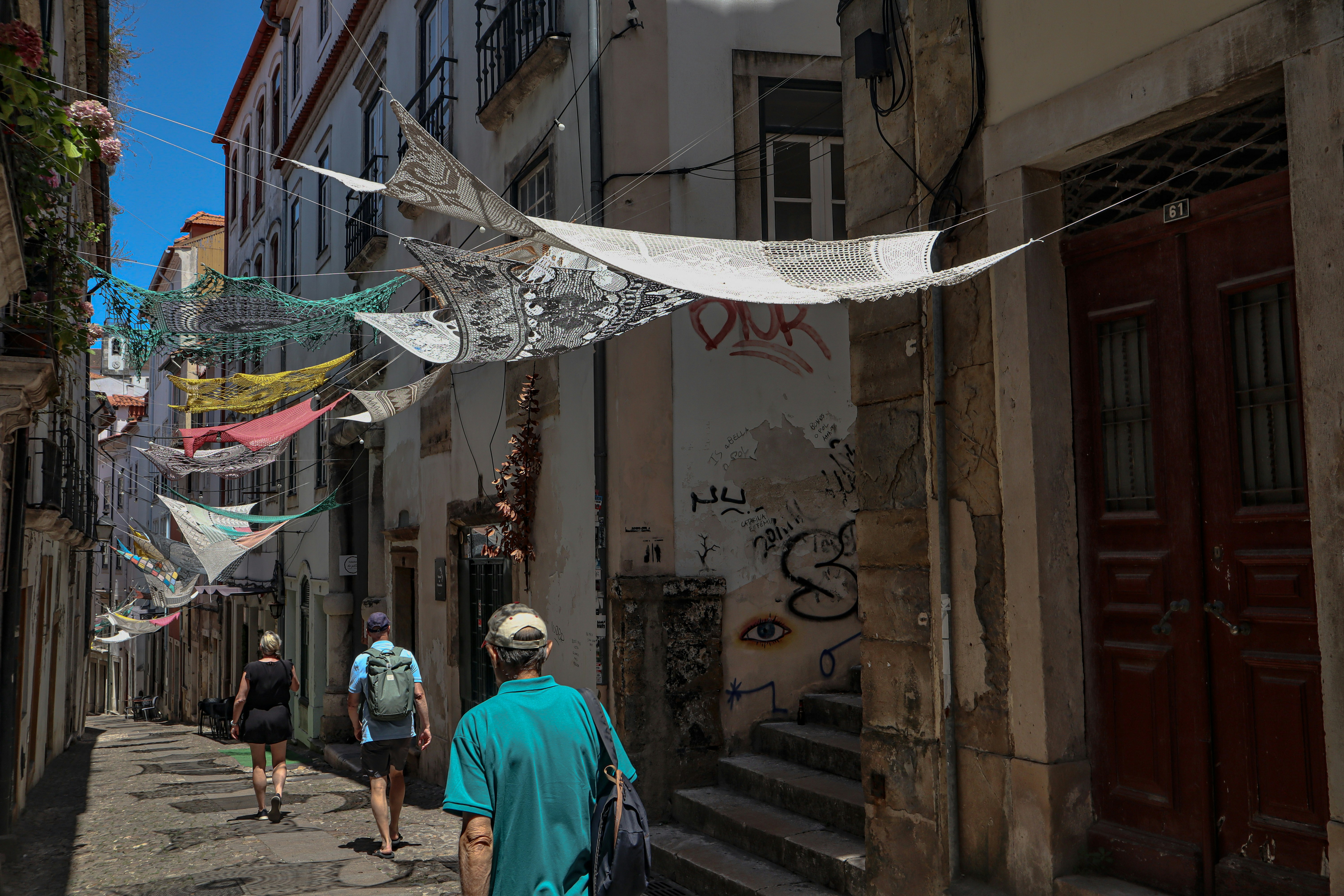 Threads of Light Over a City Alley