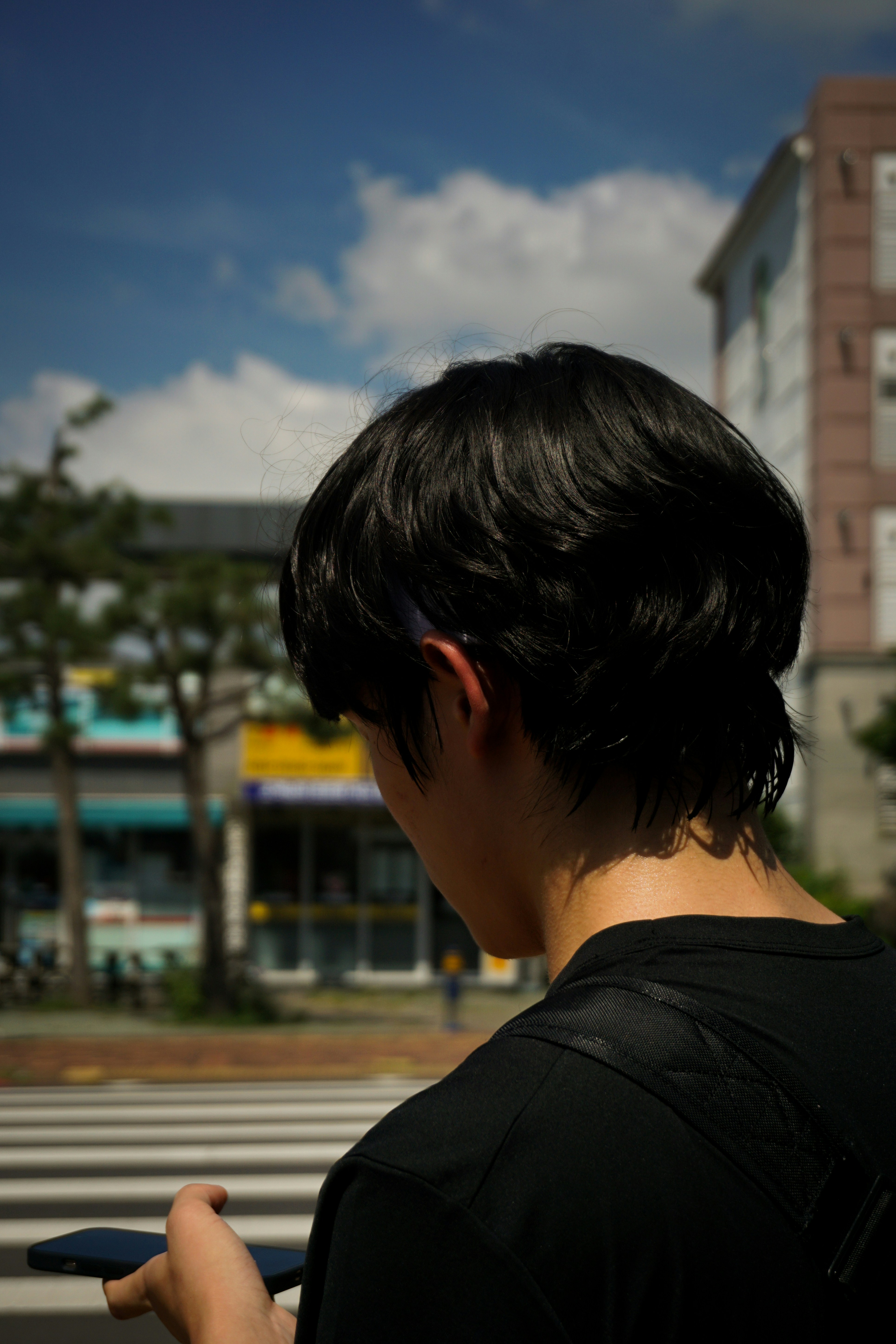 A person with a cell phone in their hand photo – Free Person facing ...