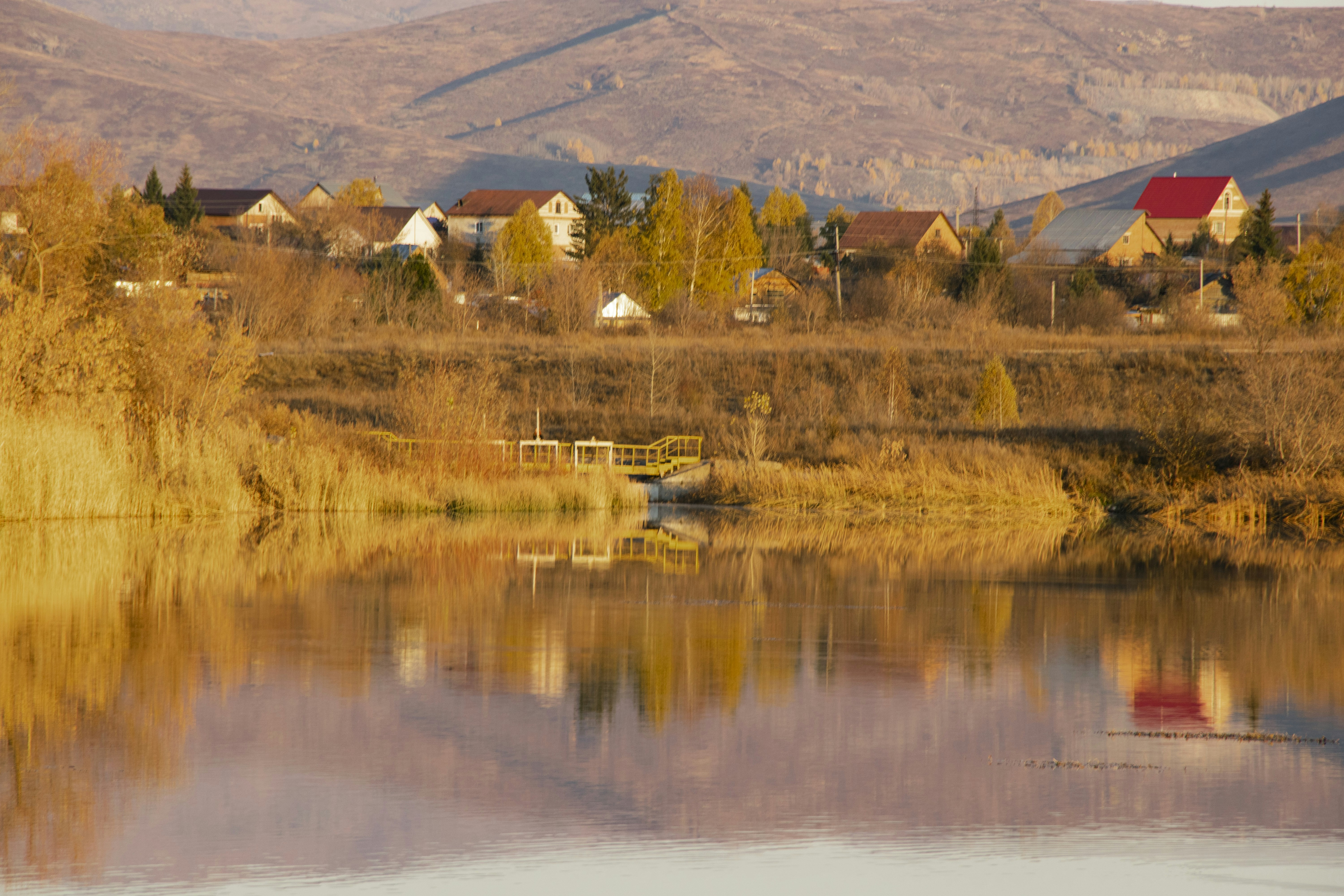Golden Hour at the Riverside Dock: Autumn Reflections