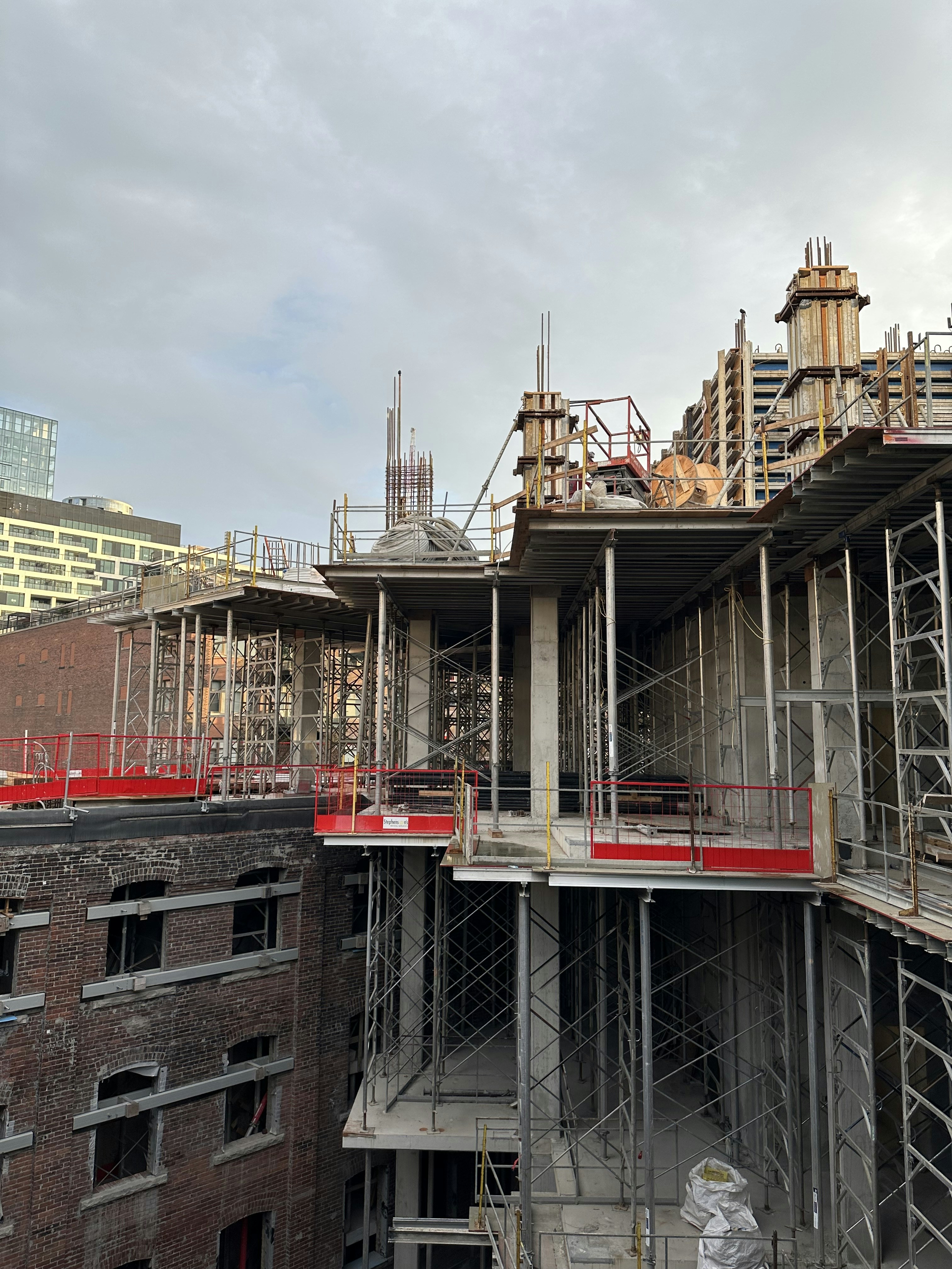 A large building under construction with scaffolding photo – Free ...