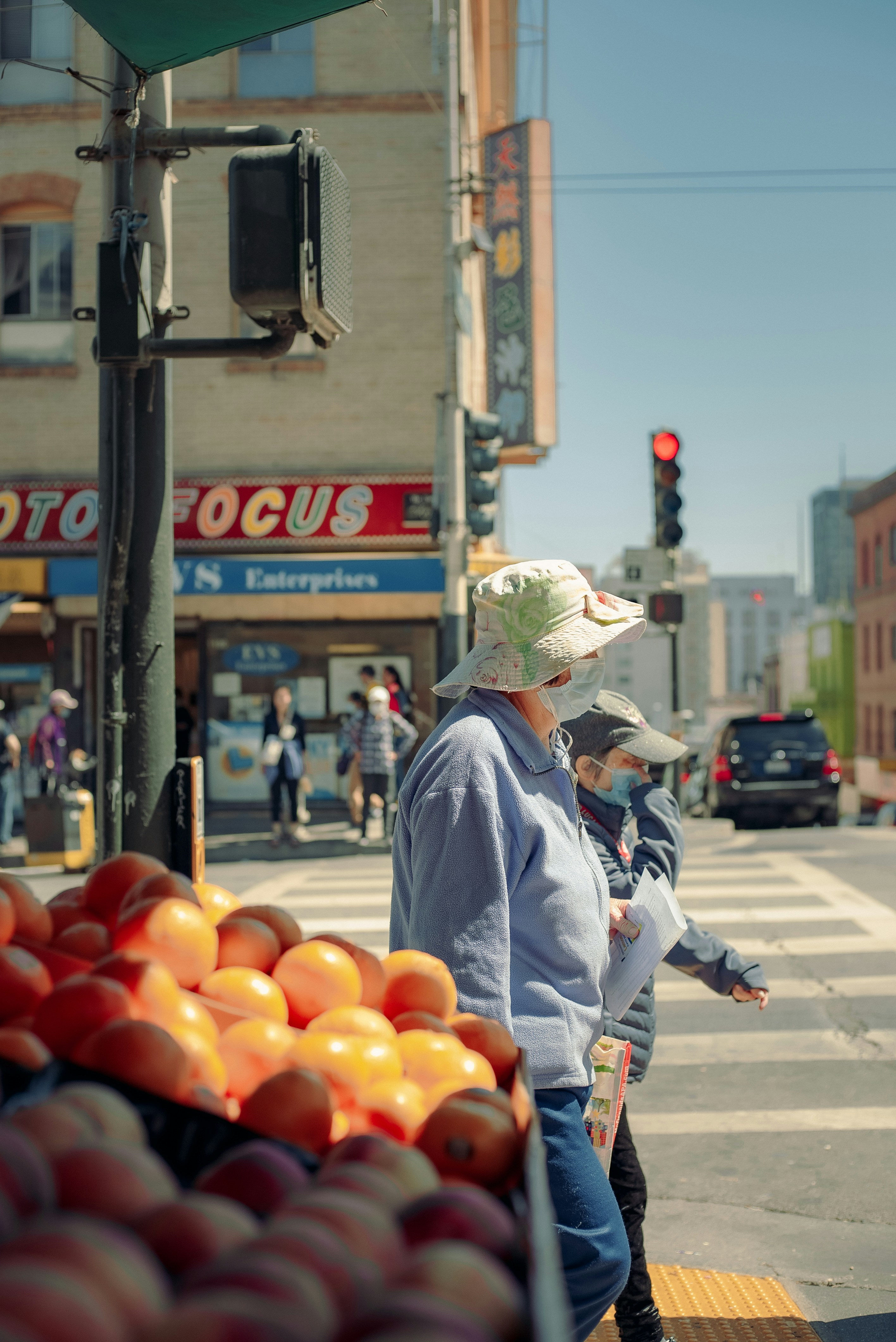Harbor of Faces: A Street Market Moment under a Sunlit Canopy