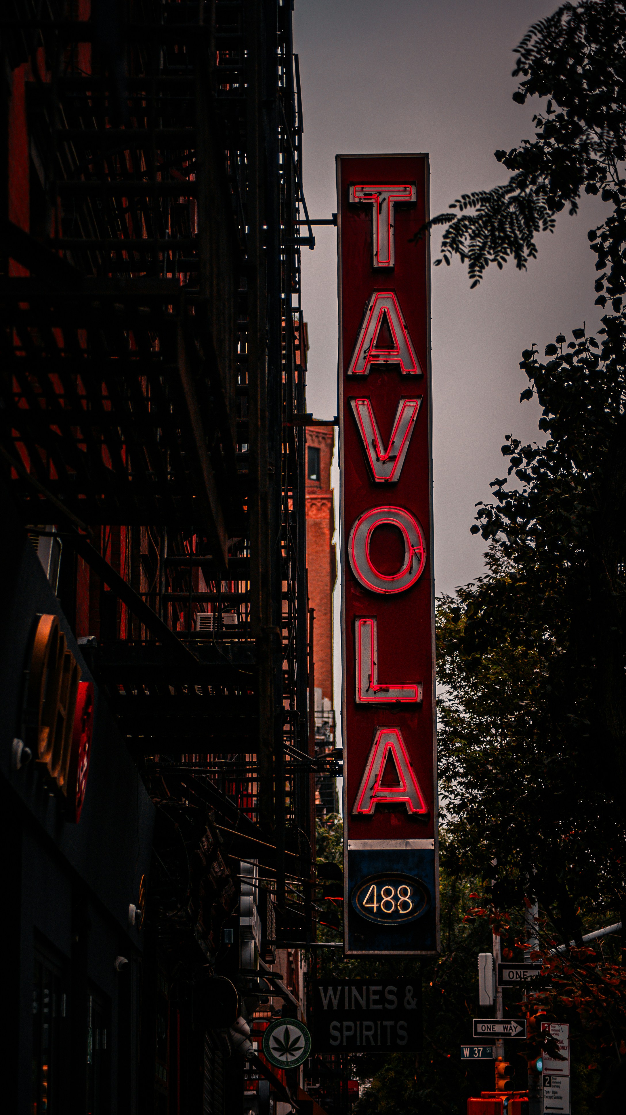 A red sign that is on the side of a building photo – Free New york ...