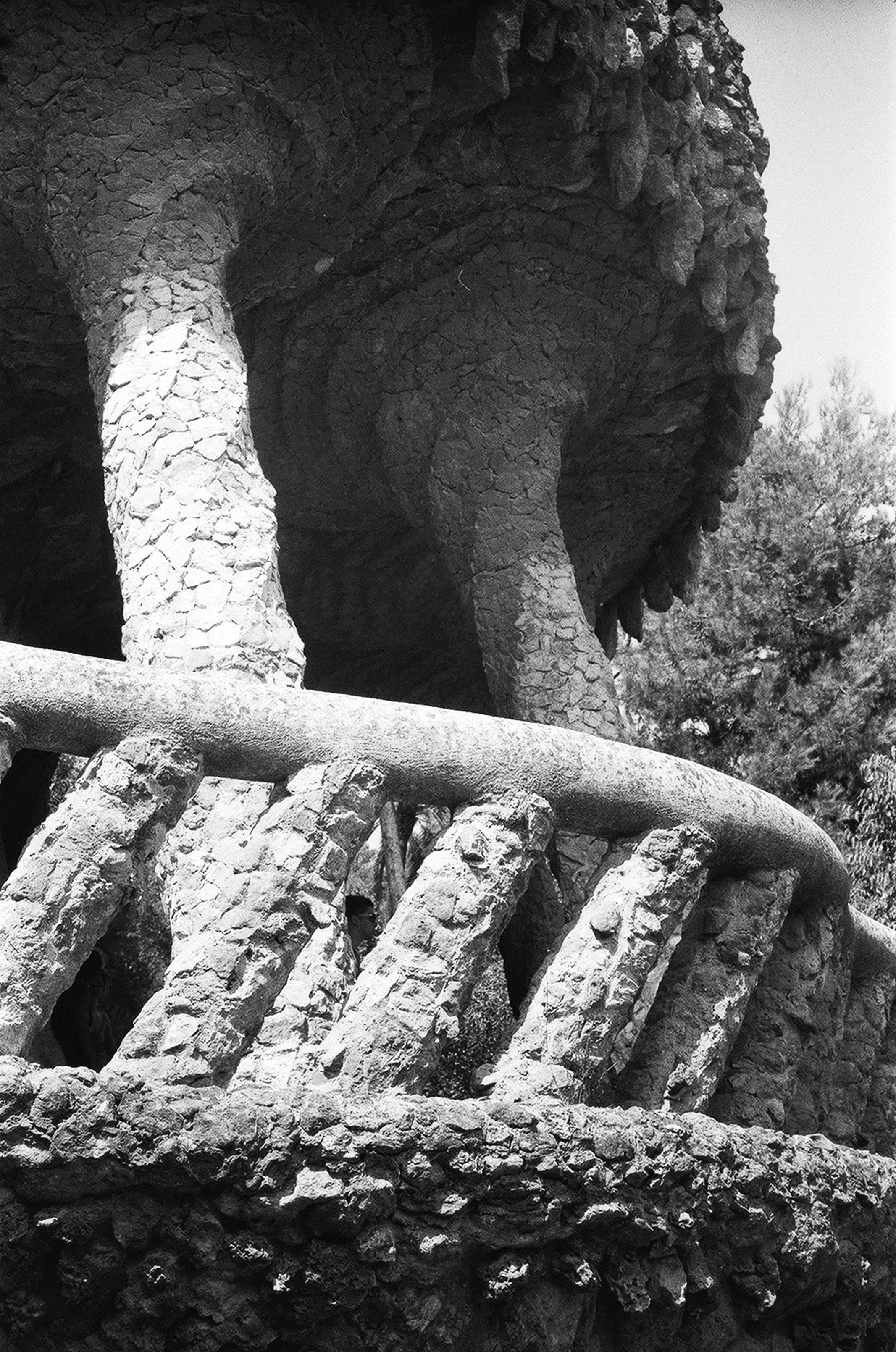 A stone structure with a tree in the background photo – Free Handrail ...