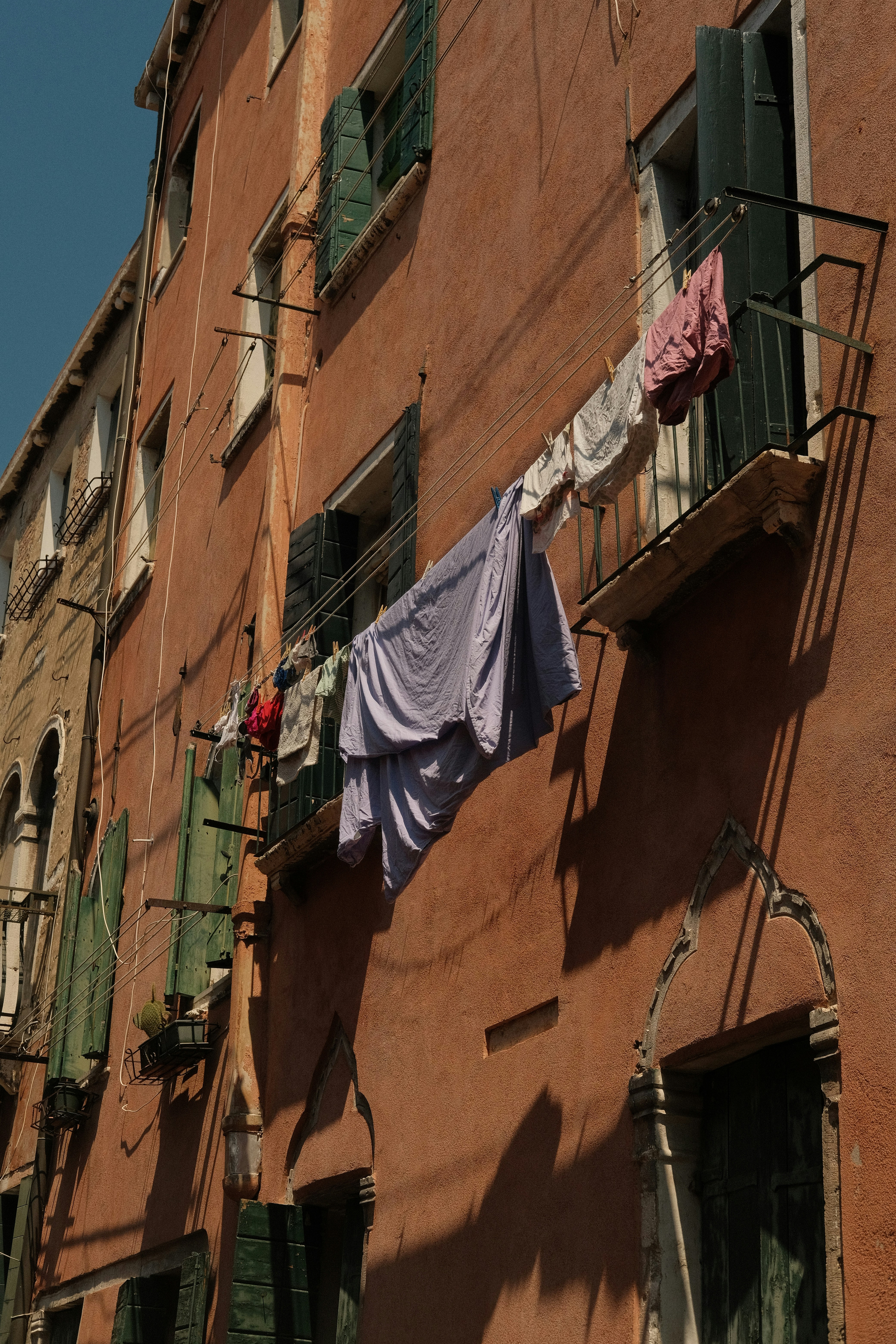 Clothes hanging from houses in Venice, Italy