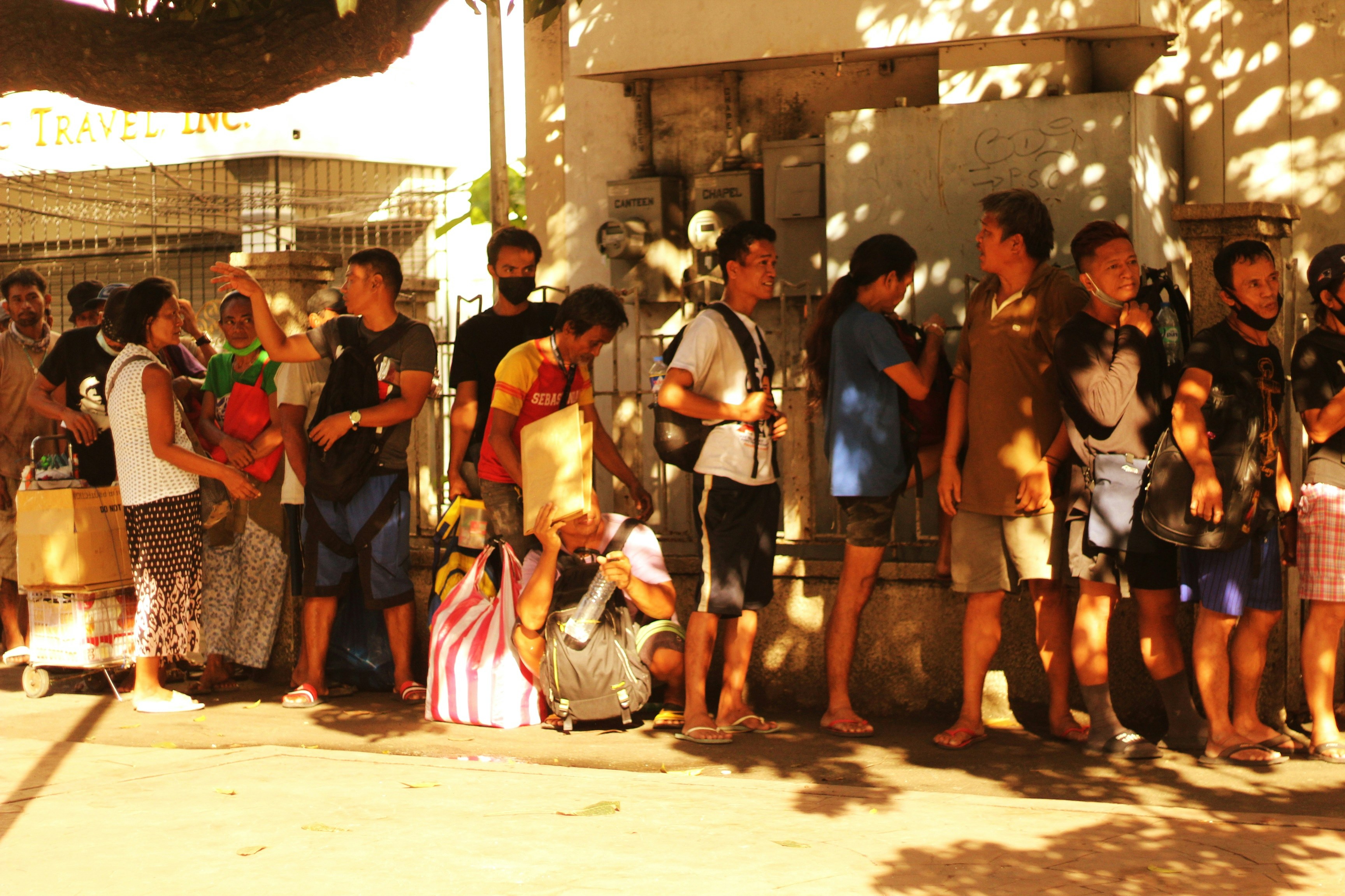 A group of people standing next to each other photo – Free Image on ...