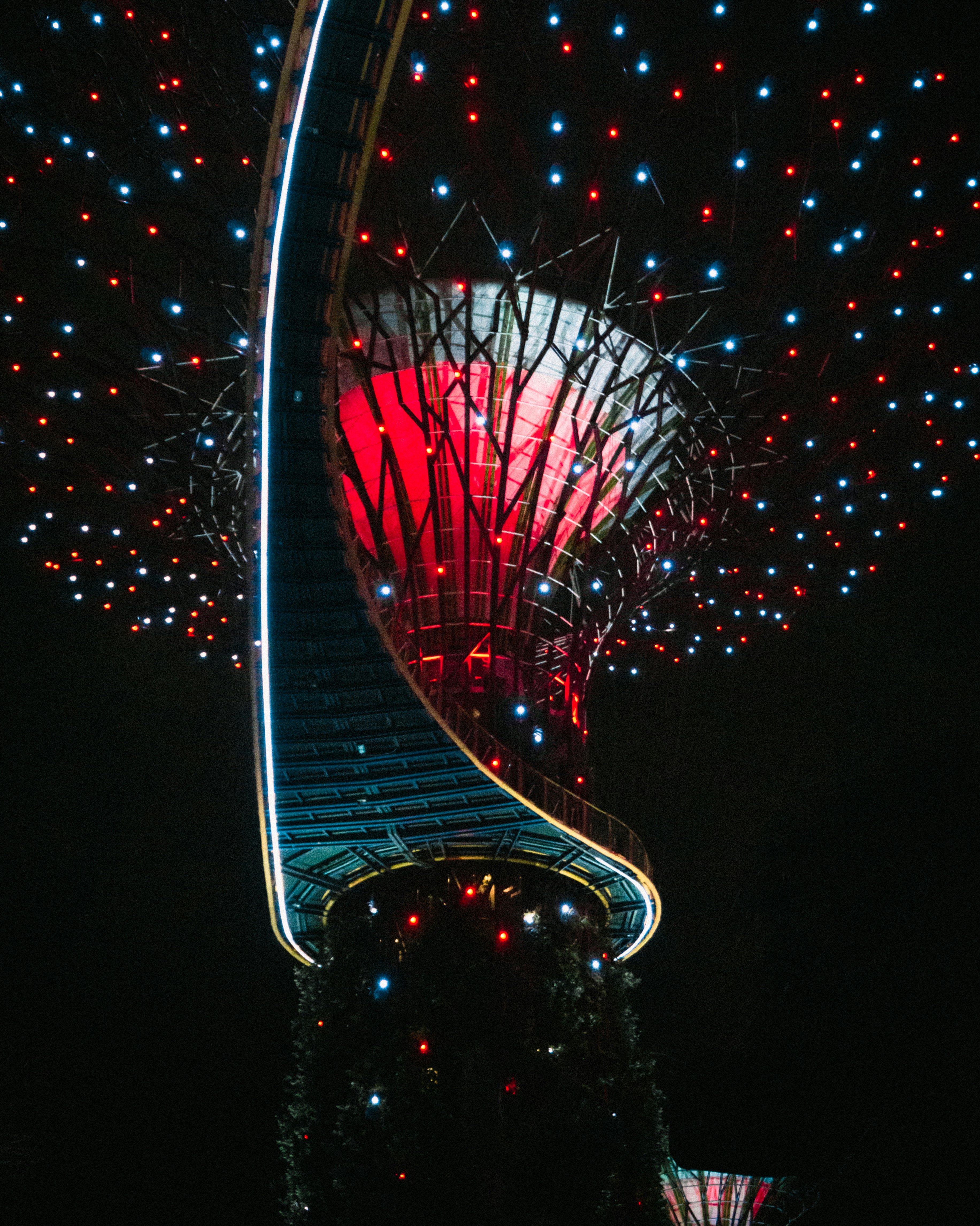 Crimson Core Above Neon Nebula: The Spindle Tower at Night